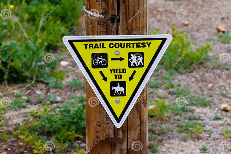Triangular Yellow Trail Courtesy Sign Stock Image - Image of wood ...