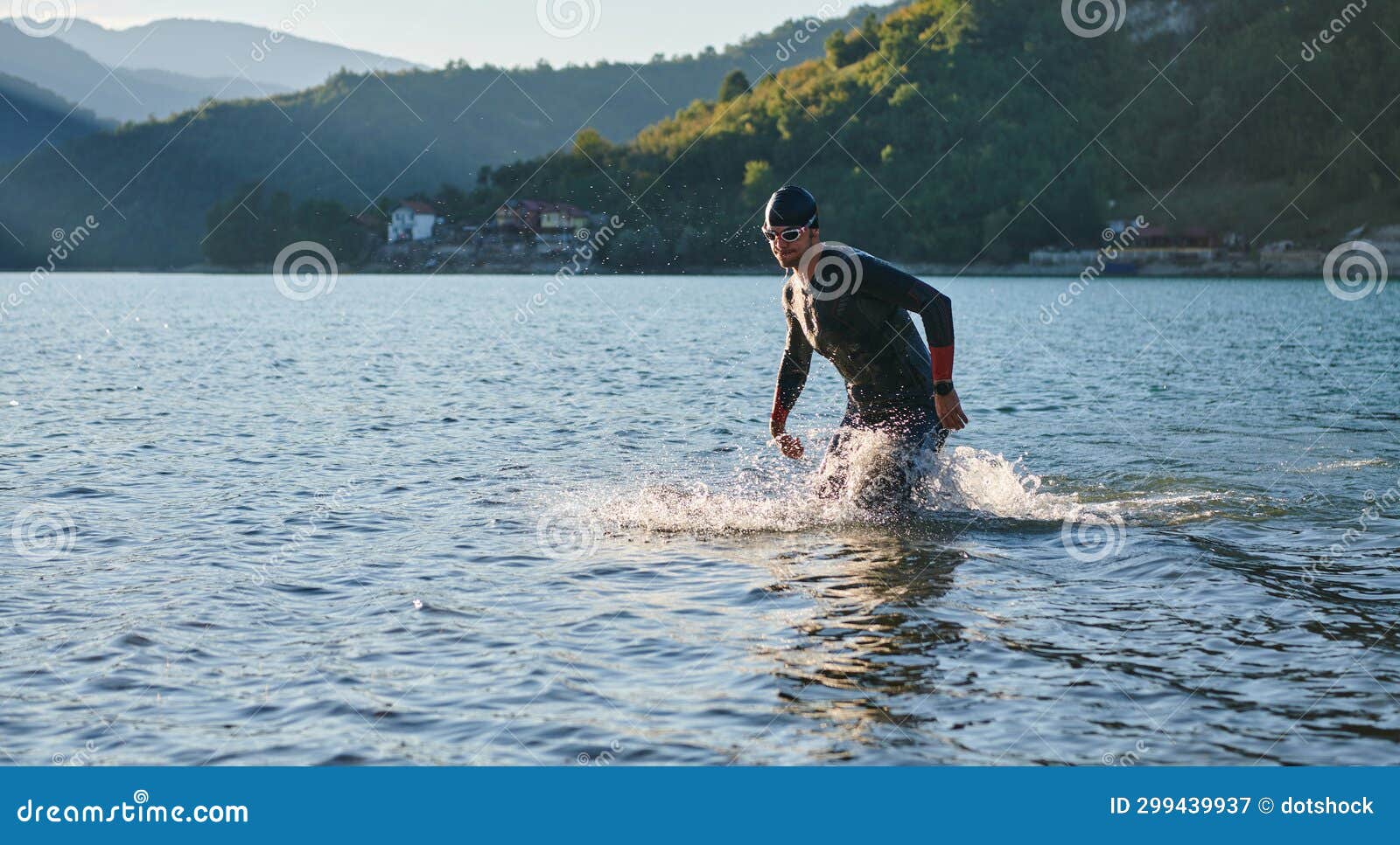 Triathlon Athlete Starting Swimming Training on Lake Stock Image ...