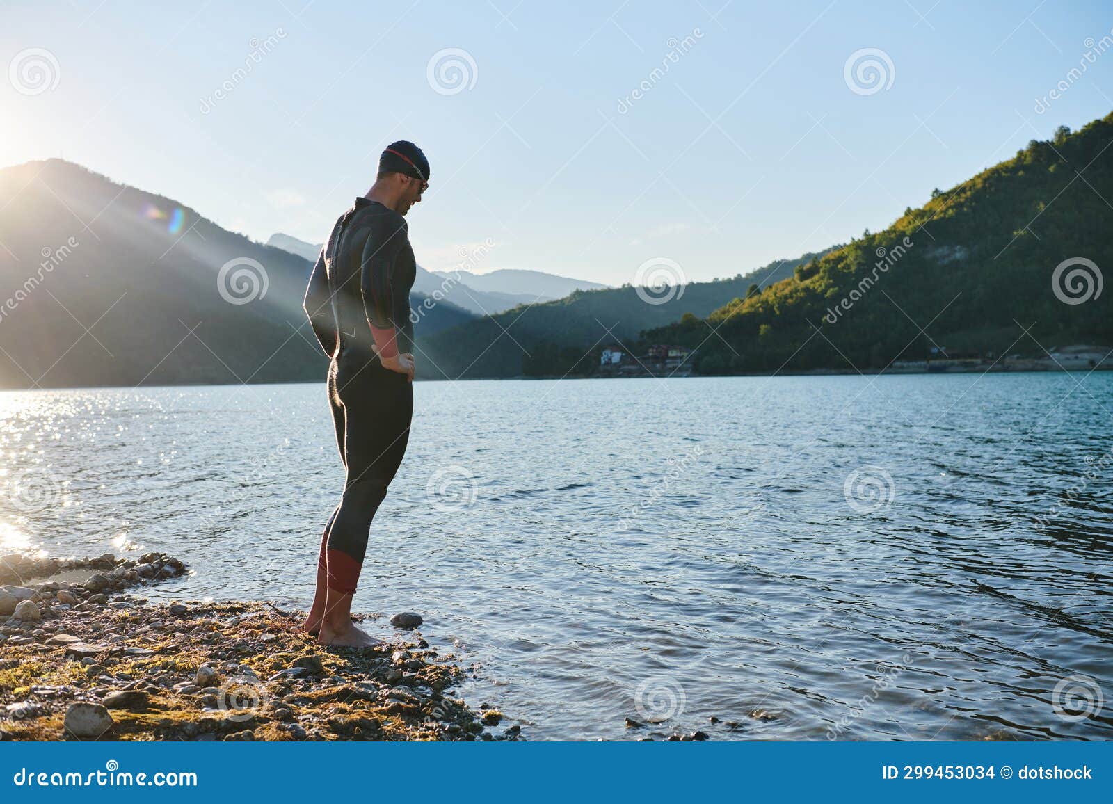 Triathlon Athlete Starting Swimming Training on Lake Stock Photo ...