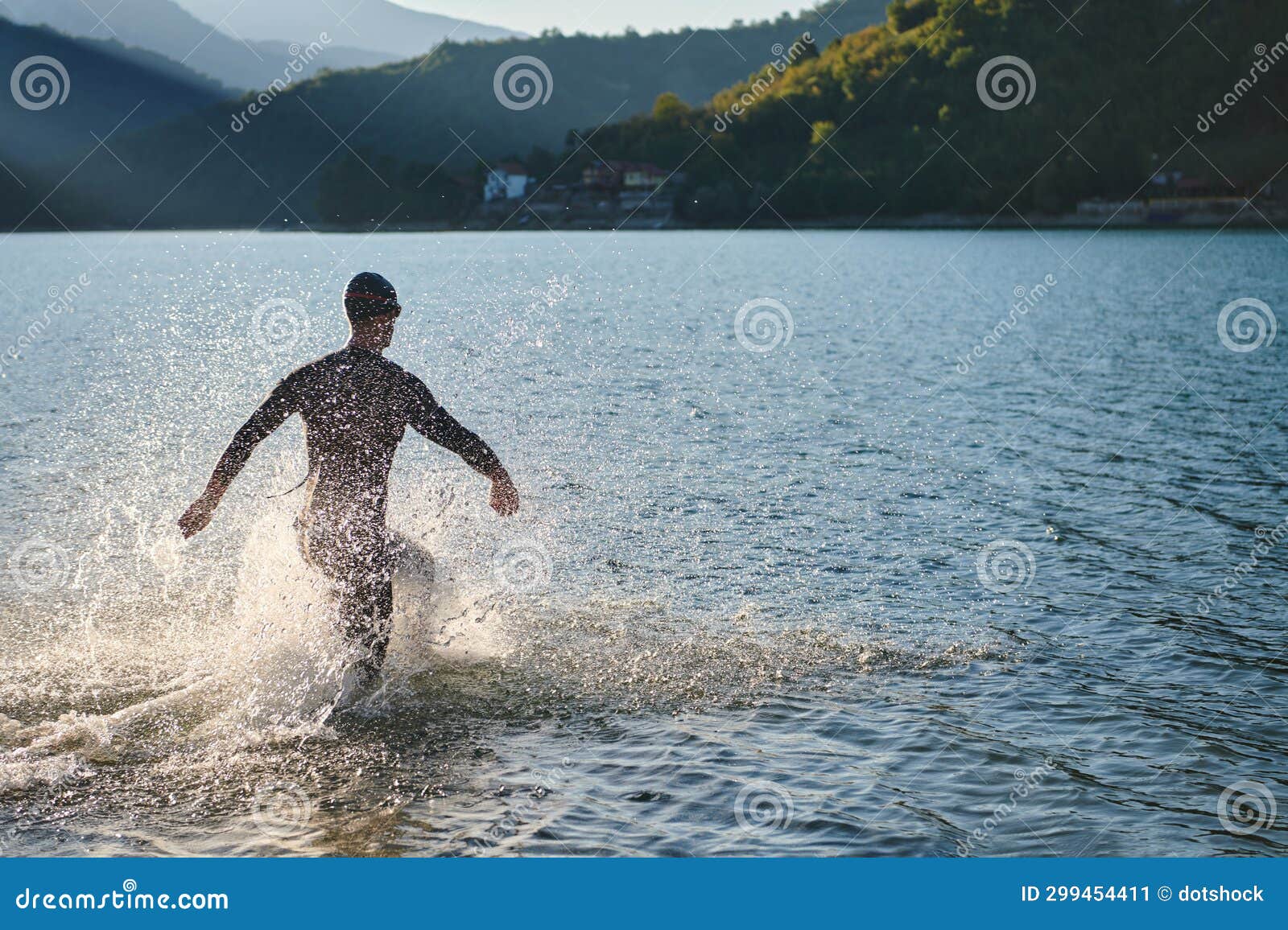 Triathlon Athlete Starting Swimming Training on Lake Stock Image ...