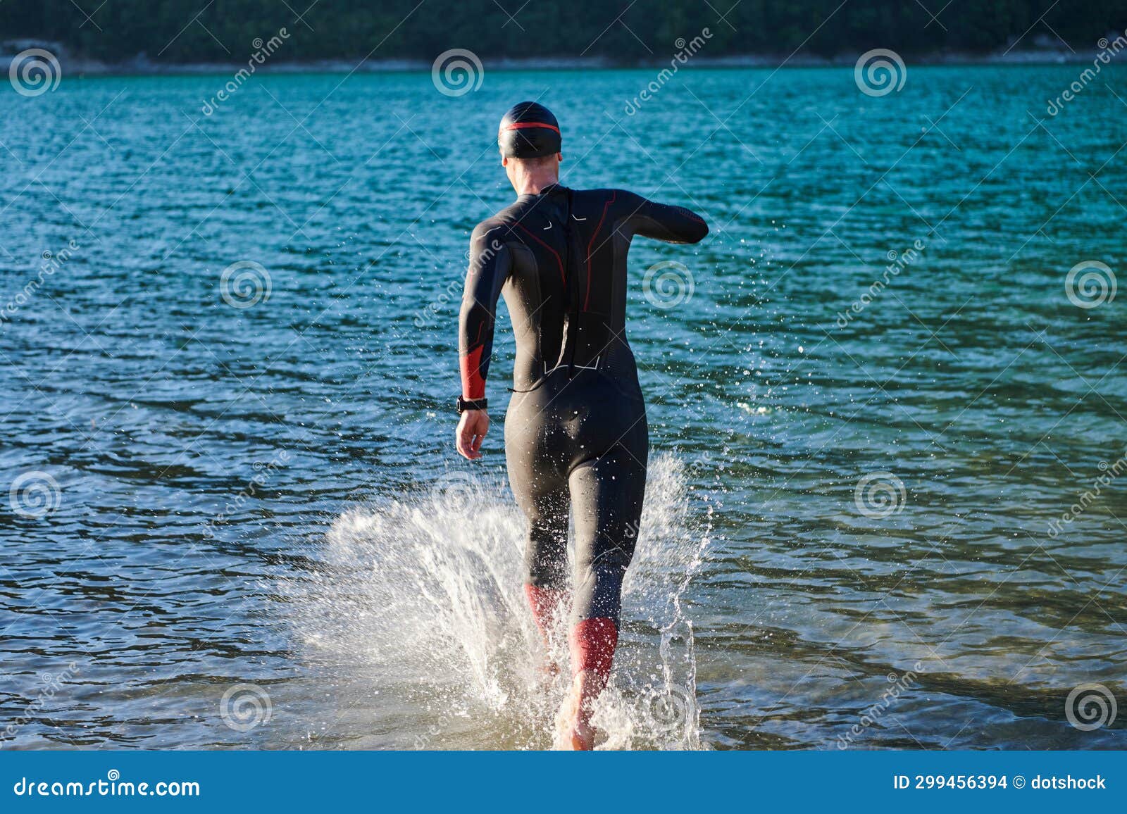 Triathlon Athlete Starting Swimming Training on Lake Stock Photo ...
