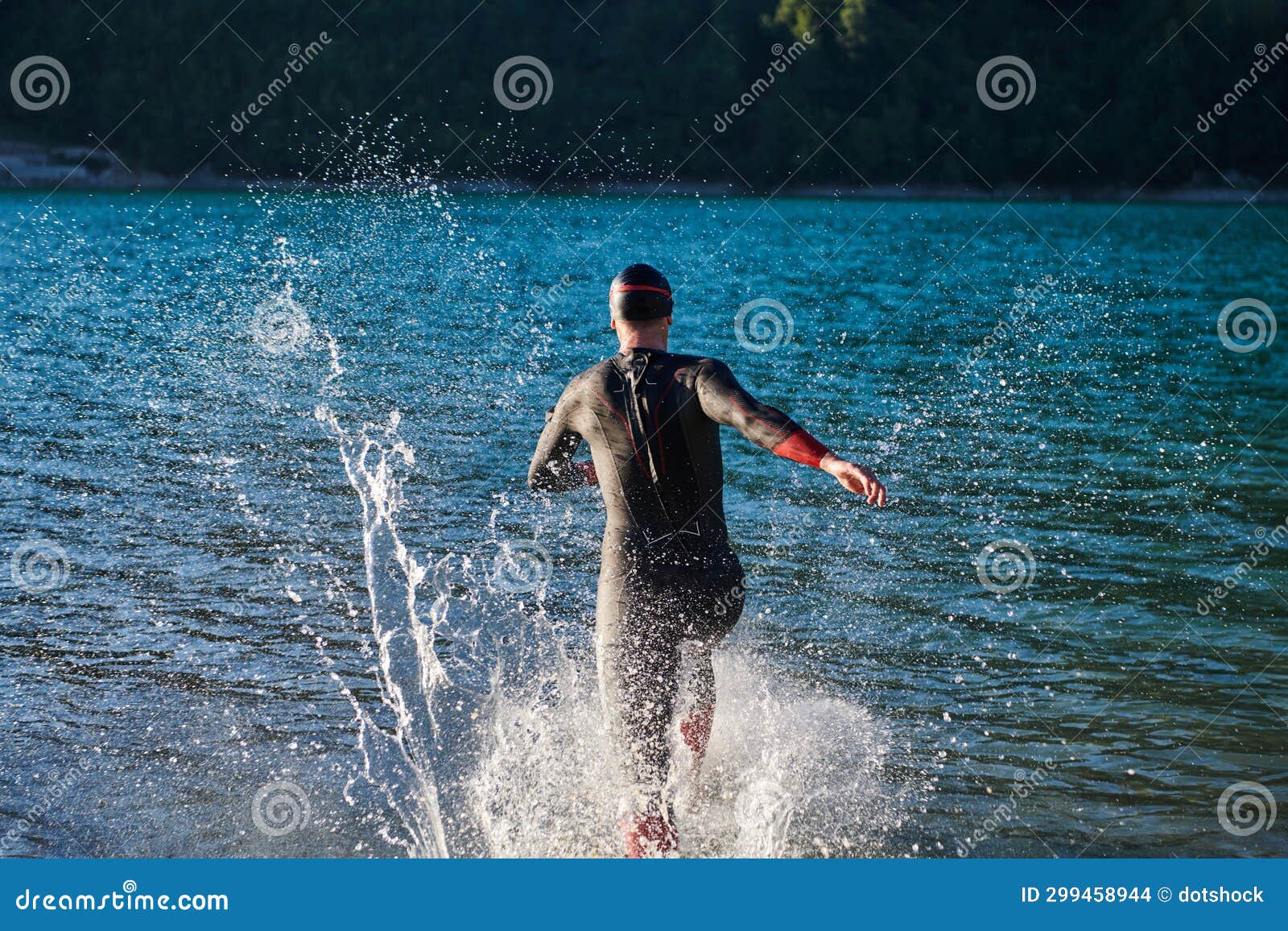 Triathlon Athlete Starting Swimming Training on Lake Stock Photo ...