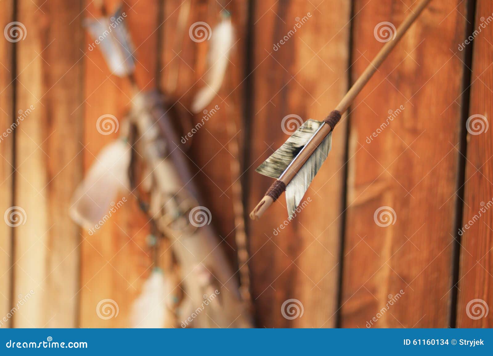 Tribal Native American Bow with Feathers Stock Photo - Image of ...