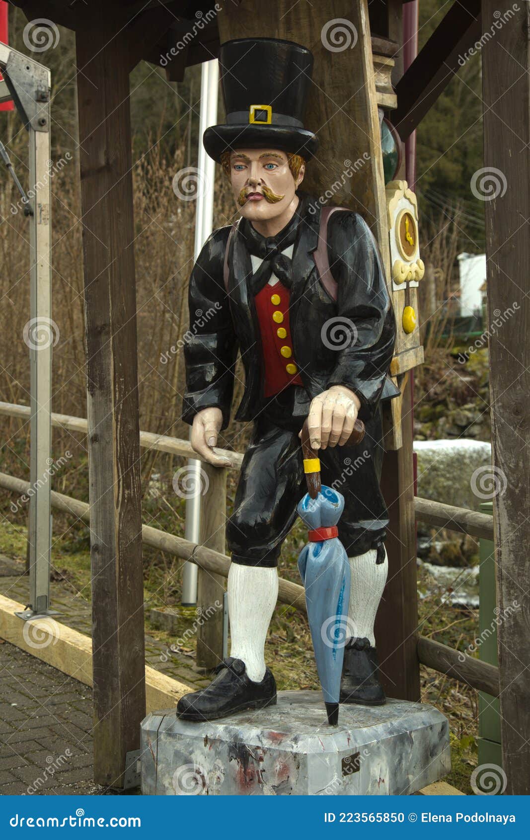 Figure of a Man Carrying a Cuckoo Clock in Triberg, Germany. Editorial ...