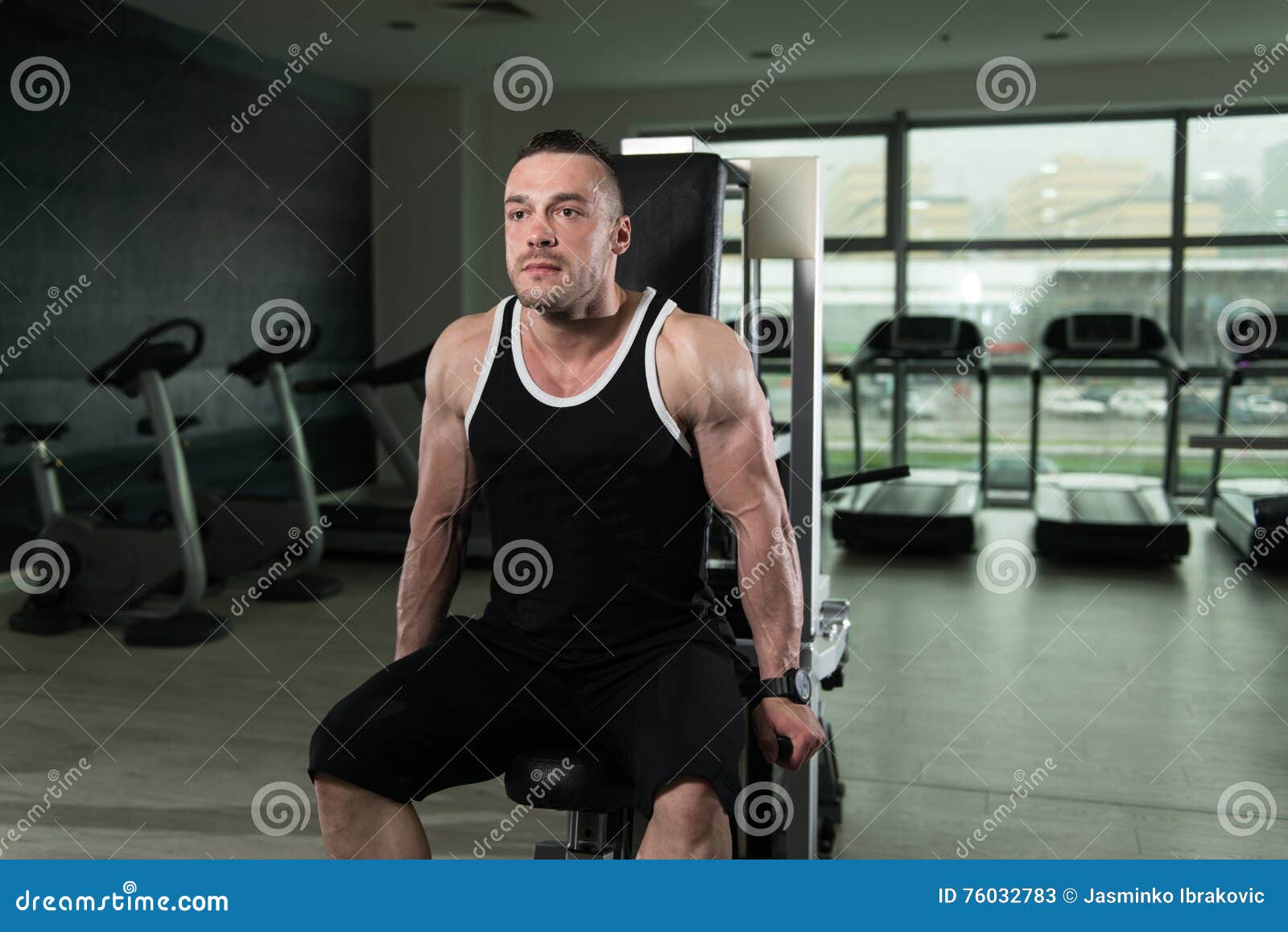 Triceps Workout on Machine stock image. Image of model - 76032783