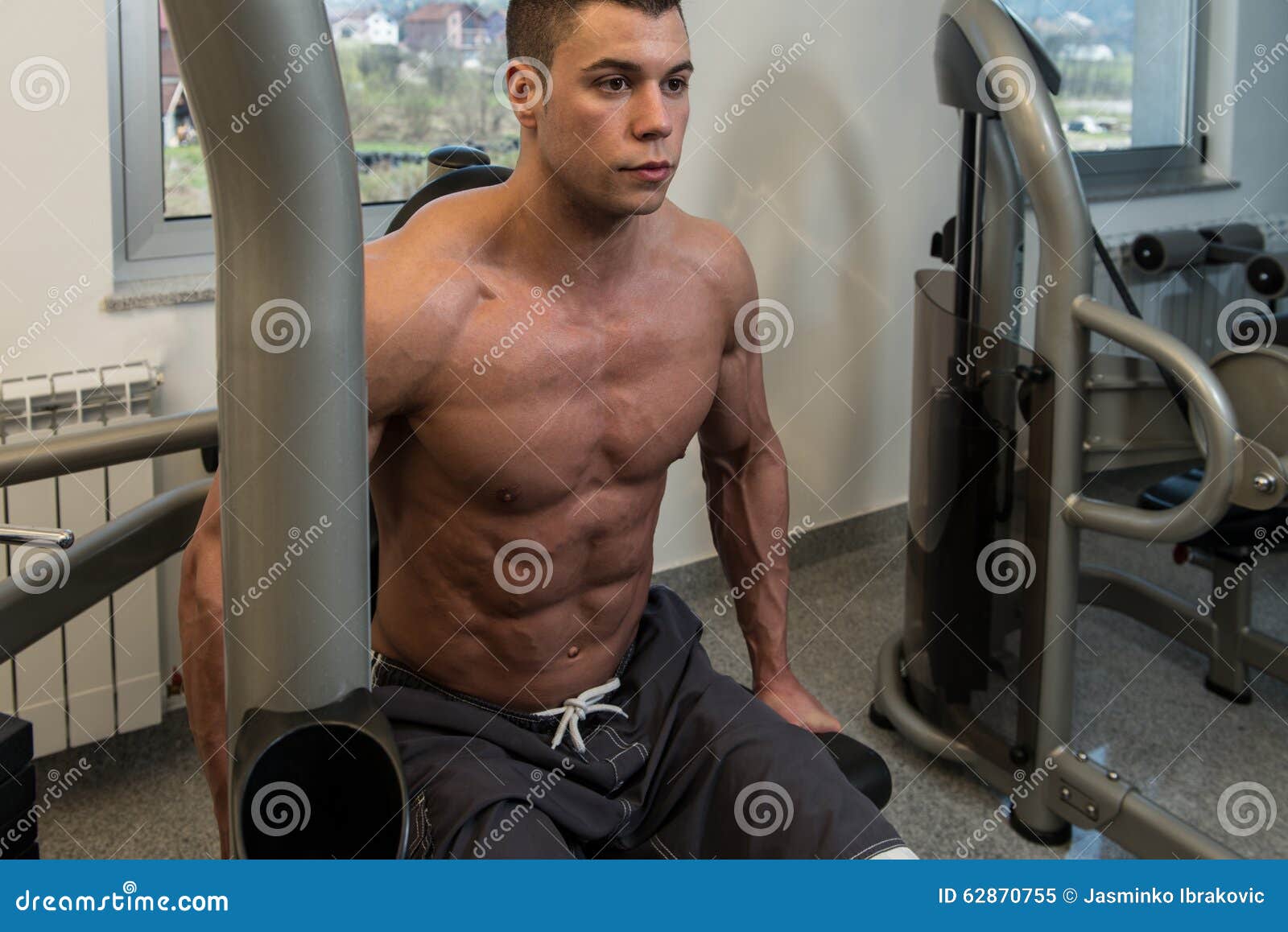 Triceps Workout on Machine stock image. Image of competition - 62870755