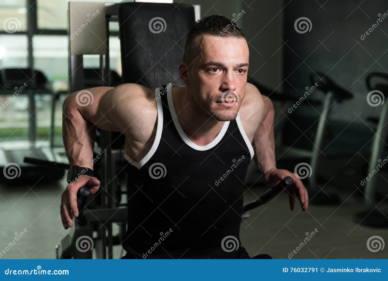 Triceps Workout on Machine stock image. Image of club - 76032791