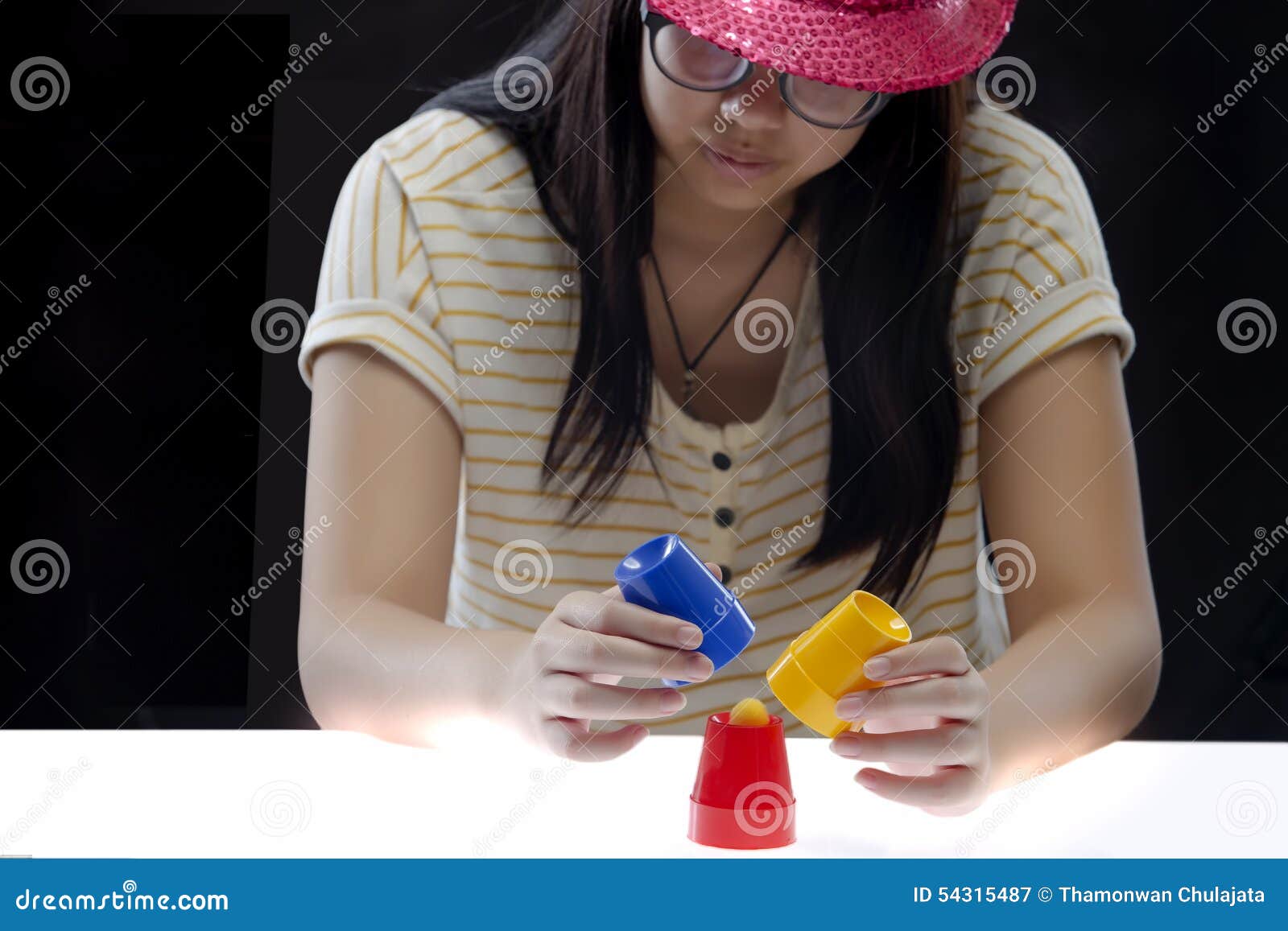 Trick with three cups stock image. Image of magician - 54315487