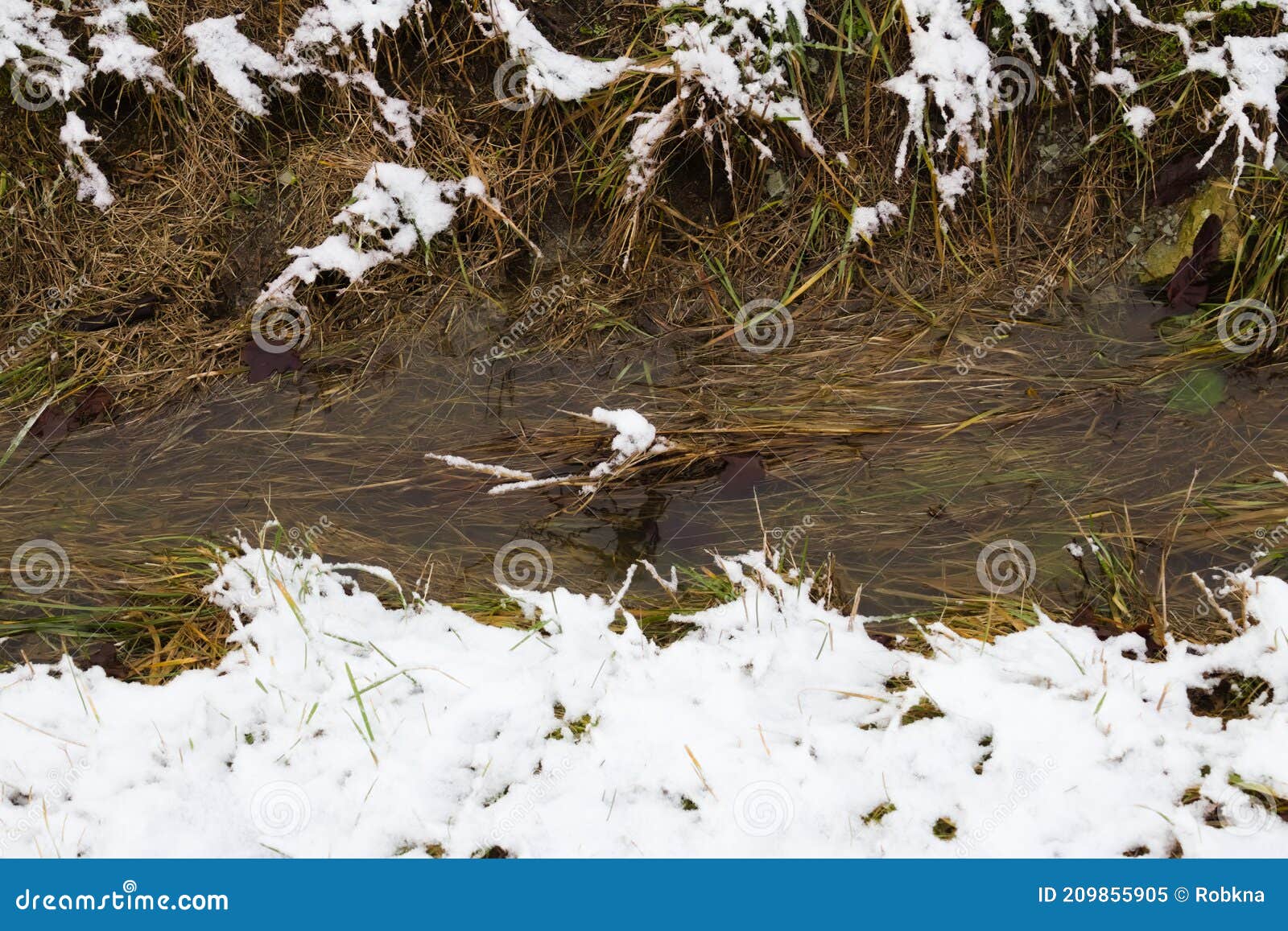 Trickle Of Water Flowing From Red Metal Drain Pipe On Cement On The ...