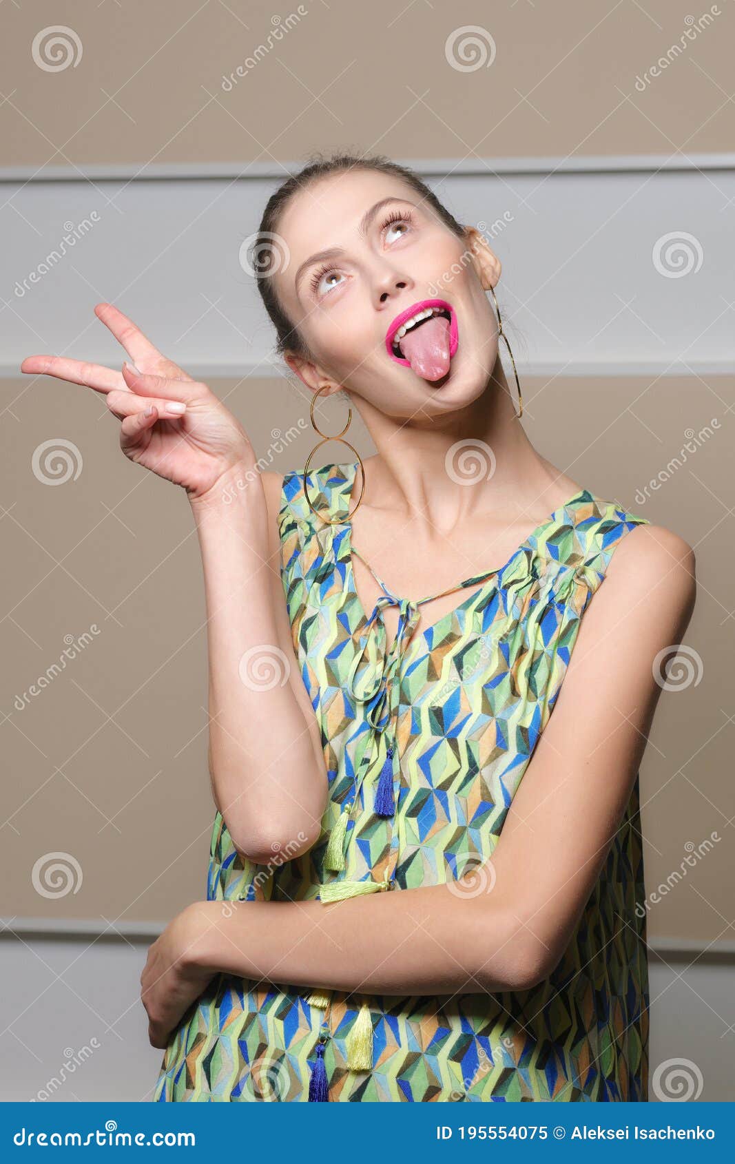 Tricky Girl Making Faces Sticking Out Tongue Opening Palm Stock Image