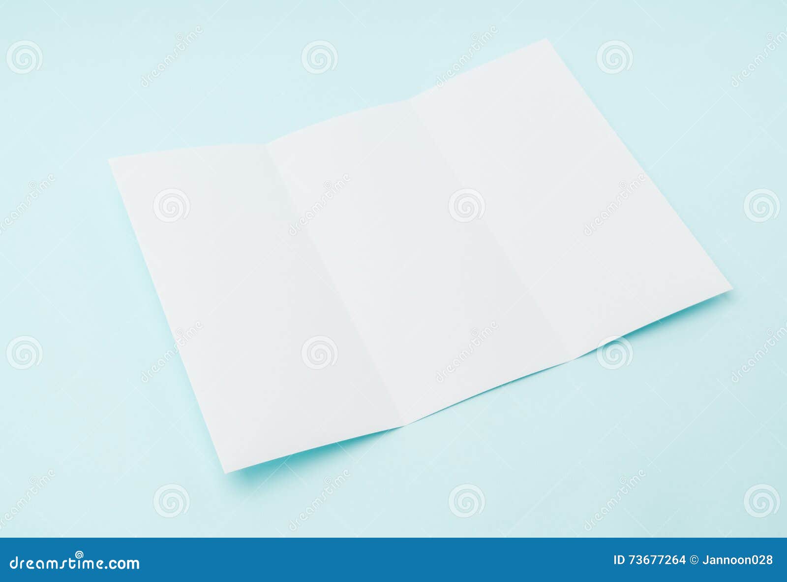 Trifold White Template Paper on Blue Background . Stock Photo - Image ...