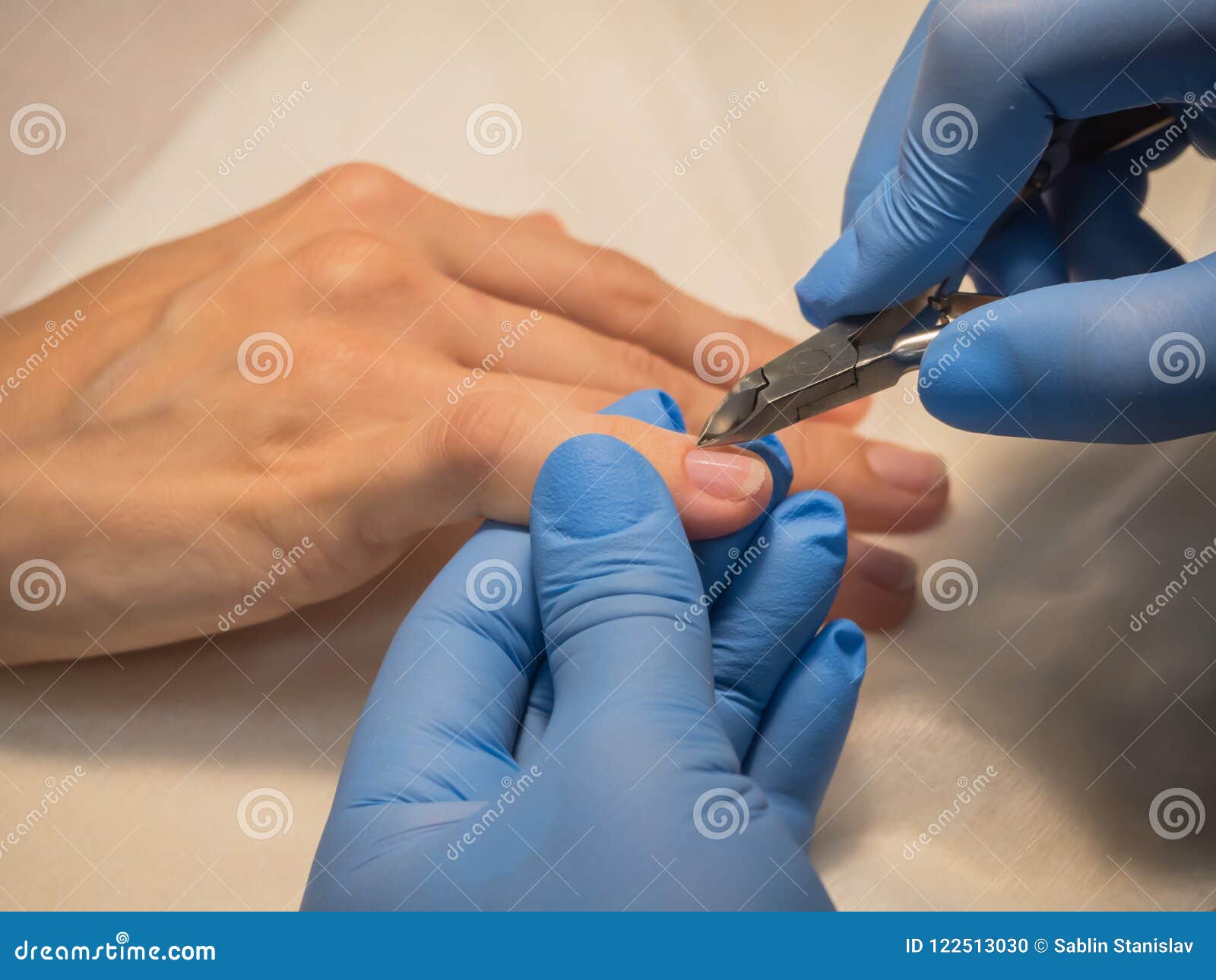 Trimming of the Cuticles in a Beauty Salon. Close Up. Stock Photo ...
