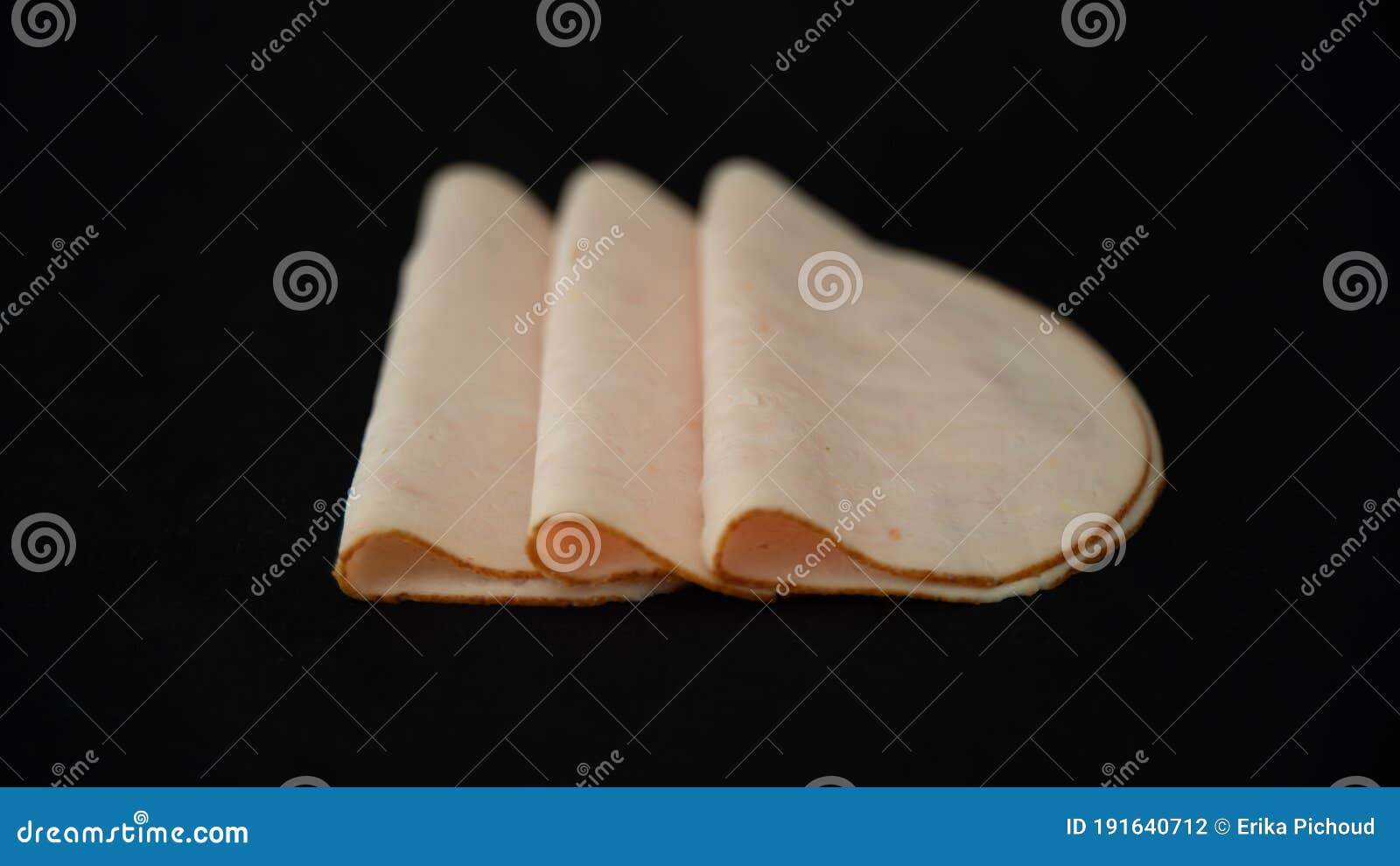 Trio of Poultry Ham Slice, Folded in Half, on a Black Background Stock ...