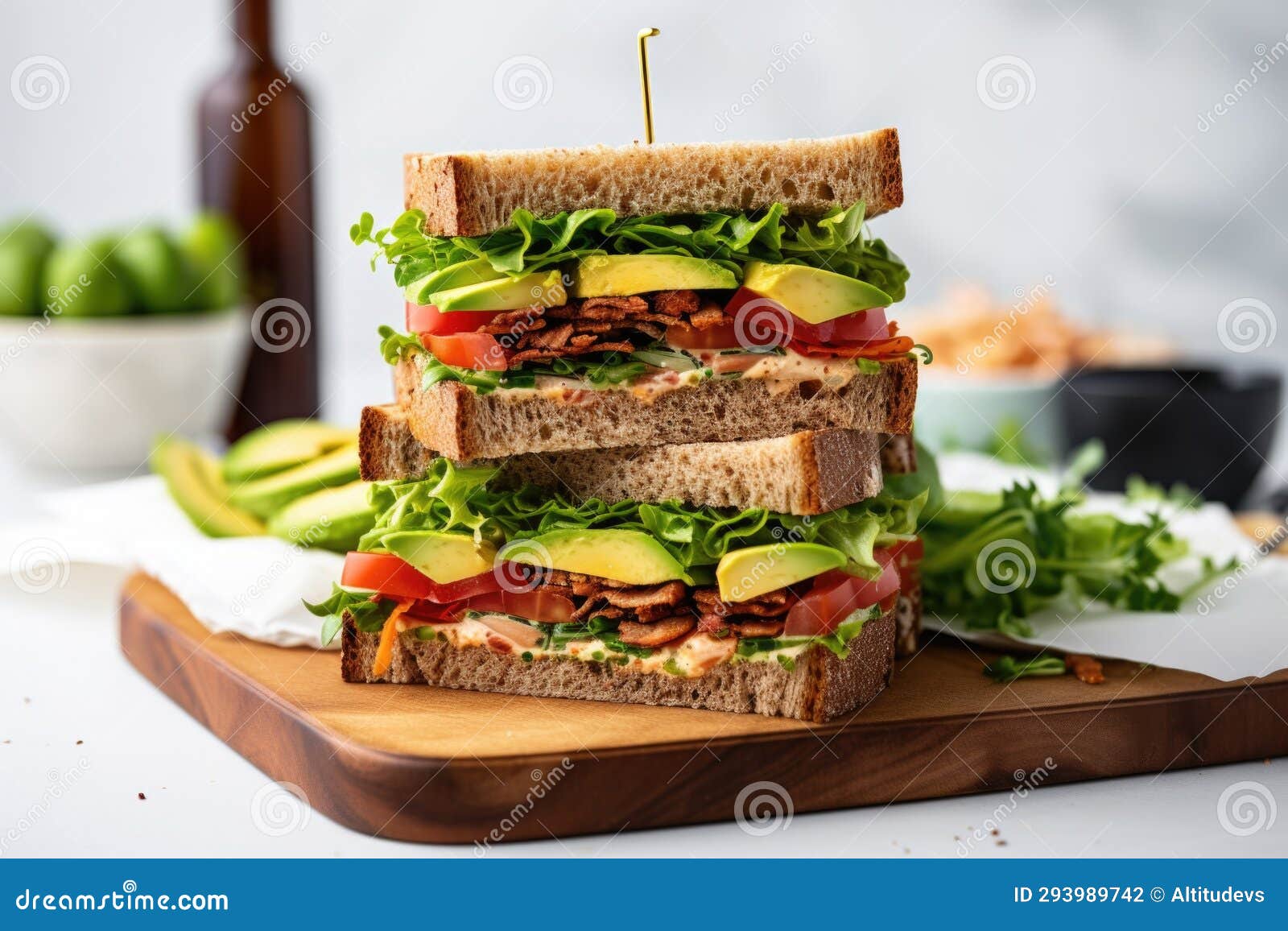 Triple Decker Sandwich in the Middle with Garnishes Around Stock Photo ...