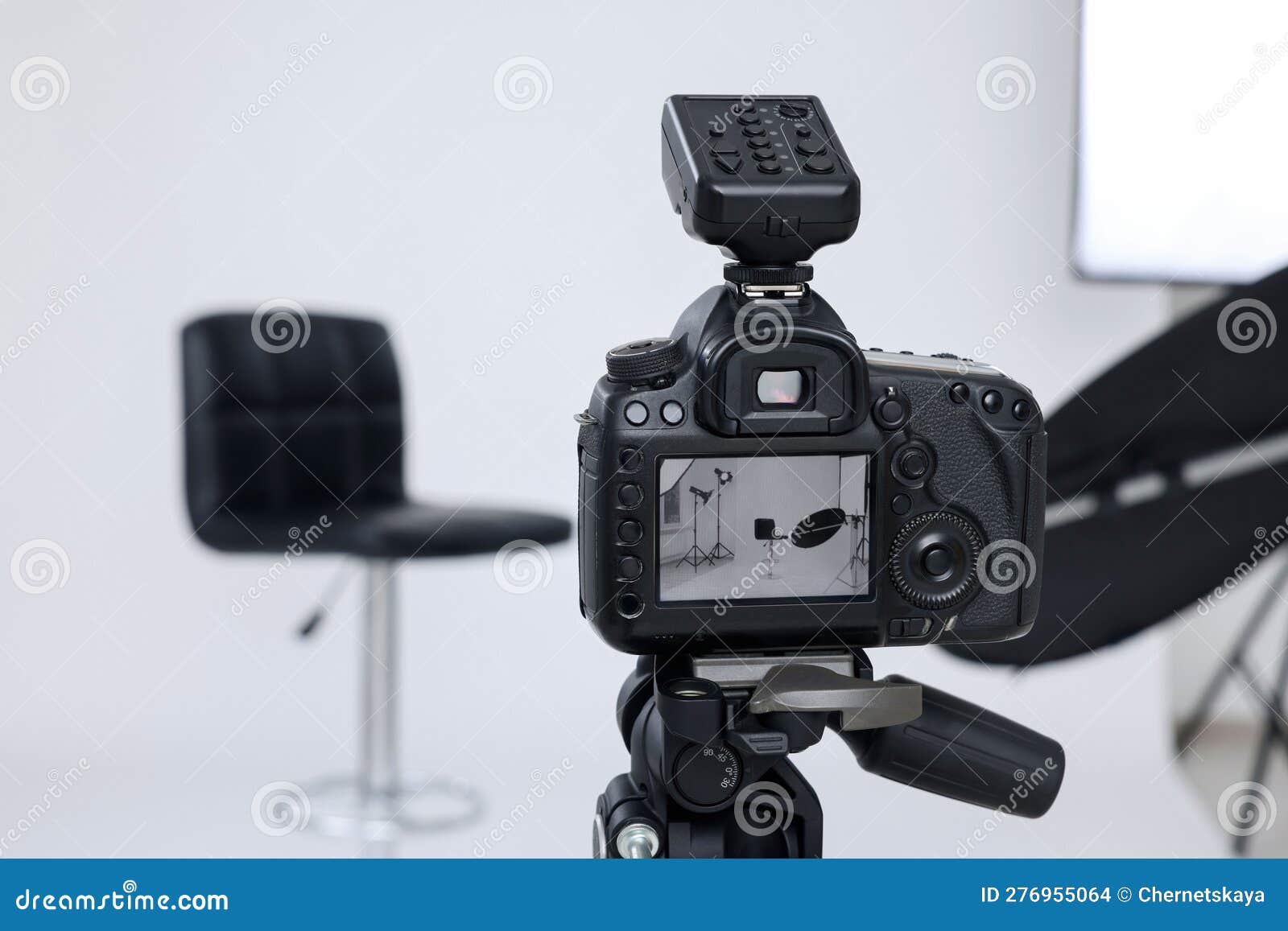 Tripod with Camera, Bar Stool and Professional Lighting Equipment in ...