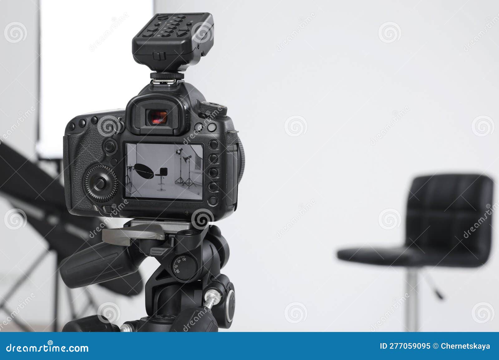 Tripod with Camera, Bar Stool and Professional Lighting Equipment in ...