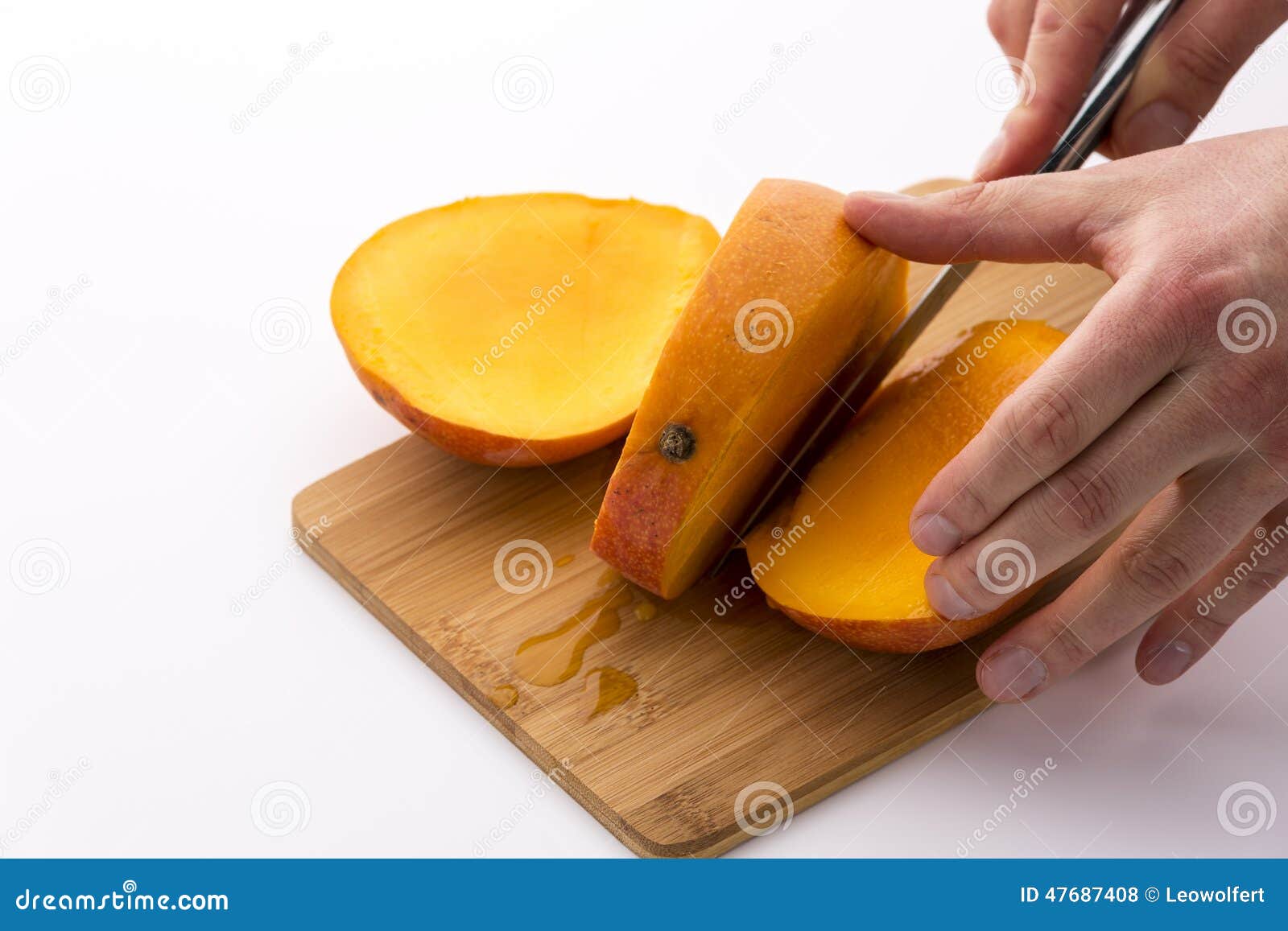 Trisecting a Mango Along Its Flat, Oblong Pip Stock Photo - Image of ...