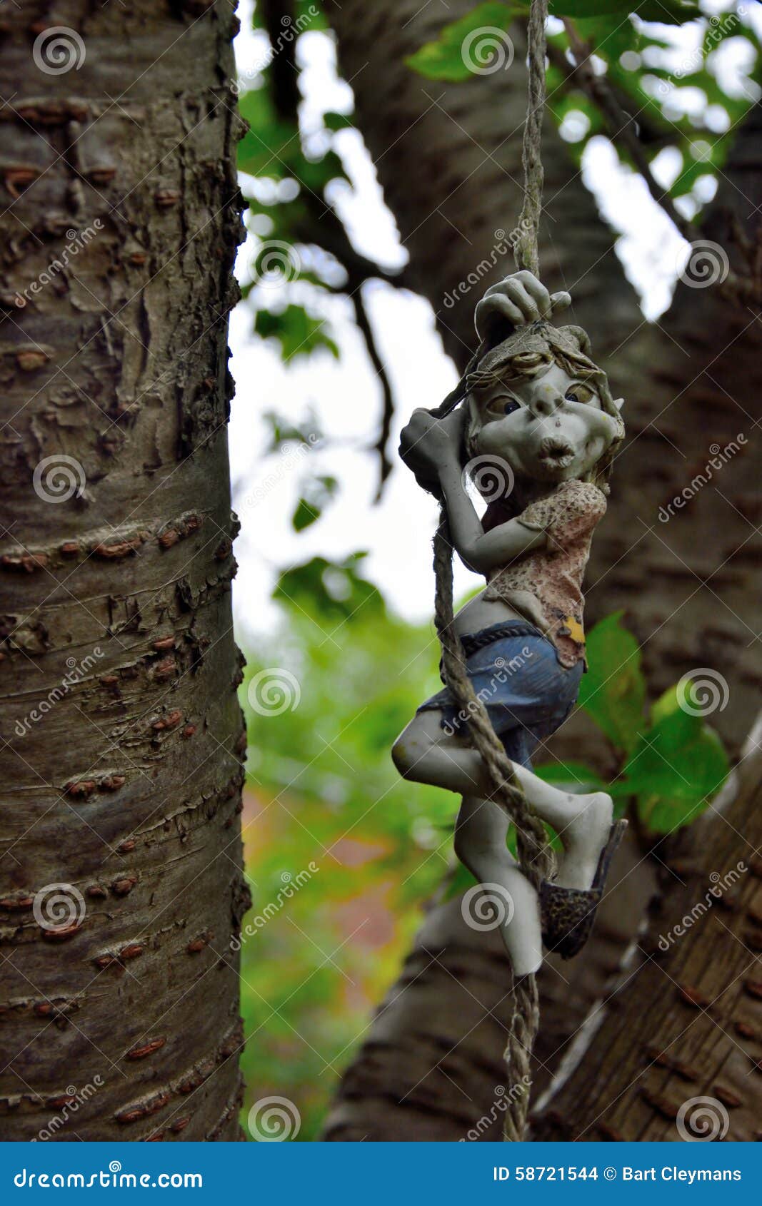Troll hanging in a tree stock photo. Image of looking - 58721544