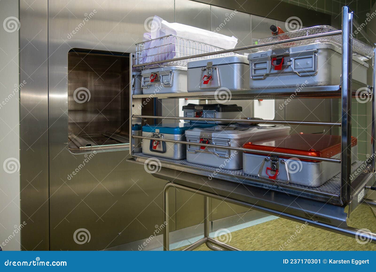 A Trolley Loaded with Instrument Containers is Pushed into a Steam ...