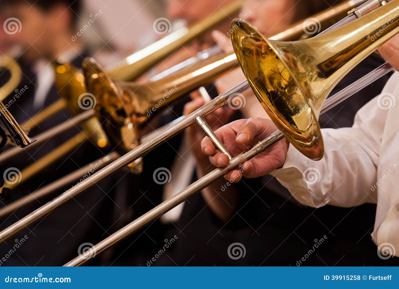 Trombones in the Hands of Musicians Stock Photo - Image of metal ...