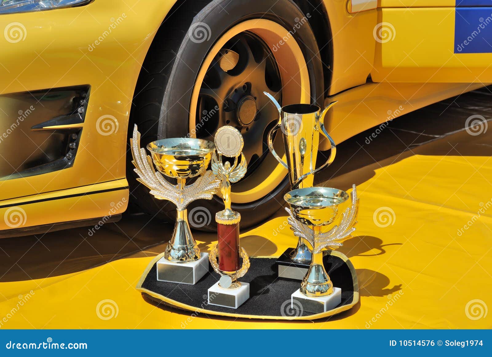 Trophies and Yellow Racing Car Stock Photo - Image of racer, speed ...