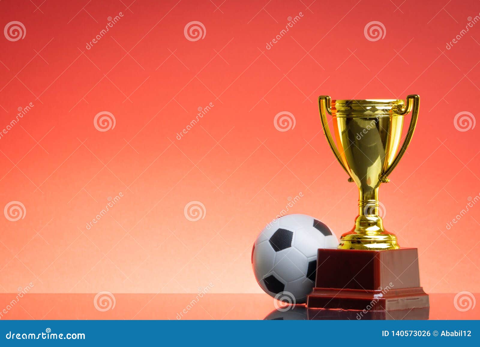 Trophy and Ball in Front of the Red Background Stock Photo - Image of ...