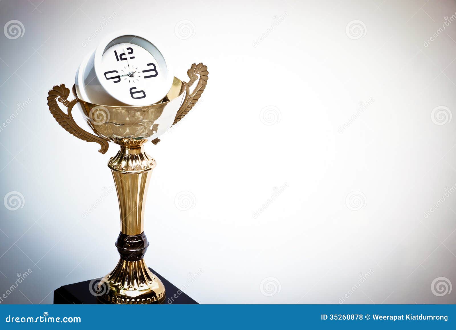 A trophy with a clock stock photo. Image of achievement - 35260878