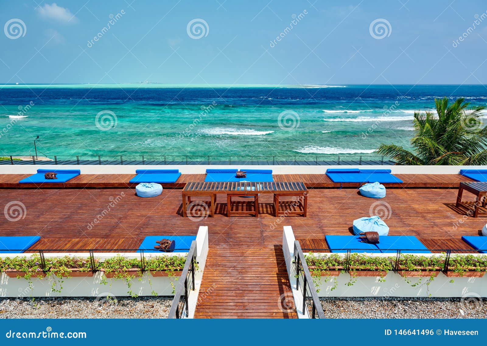 Tropical Beach with Patio Deck Stock Photo - Image of terrace, resort ...