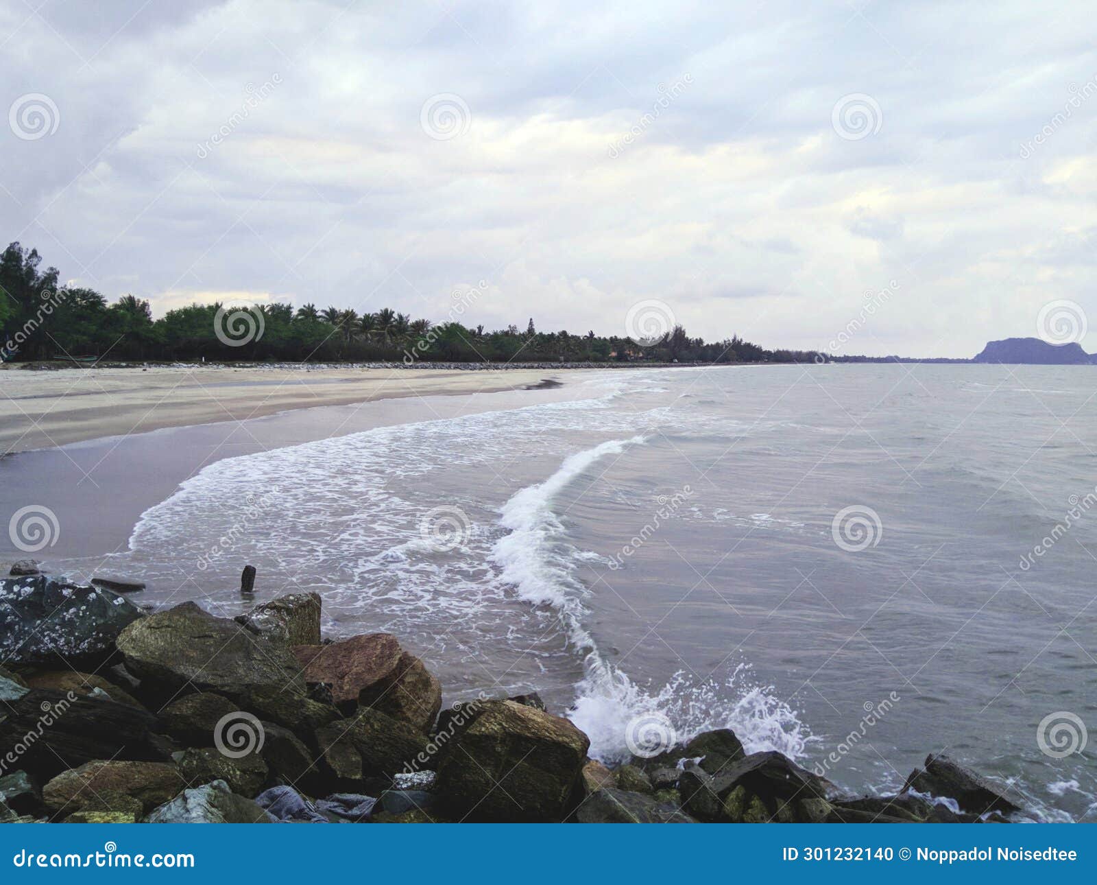 Tropical Beach with Rocks and Ocean Waves at Sunset Stock Photo - Image ...