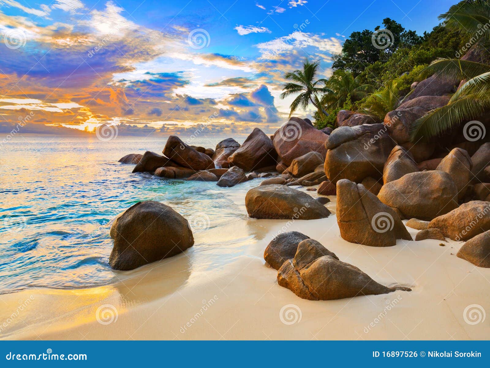 Tropical beach at sunset stock photo. Image of island - 16897526
