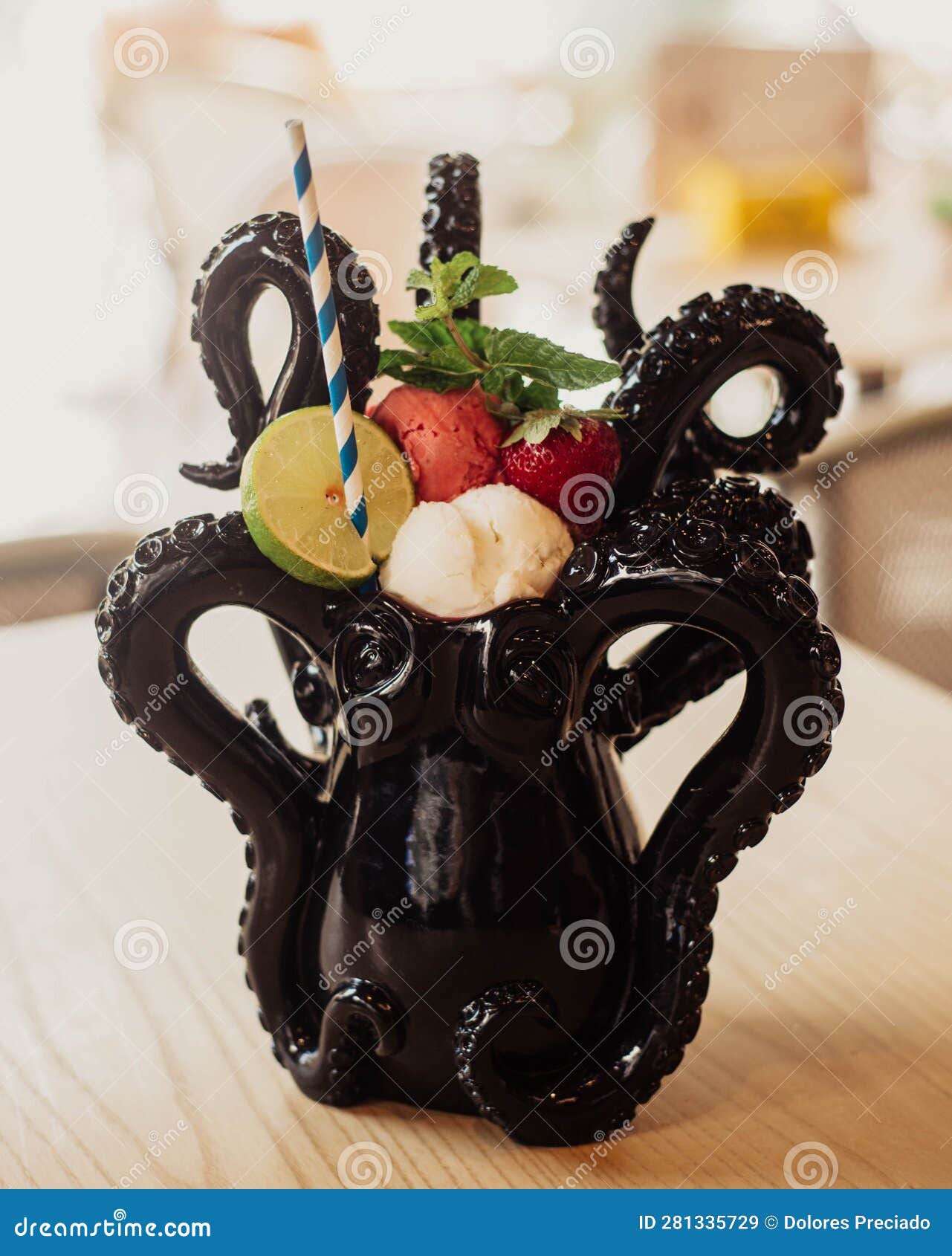 Tropical Cocktail of Rum and Fruit Ice Cream Served in an Octopus ...