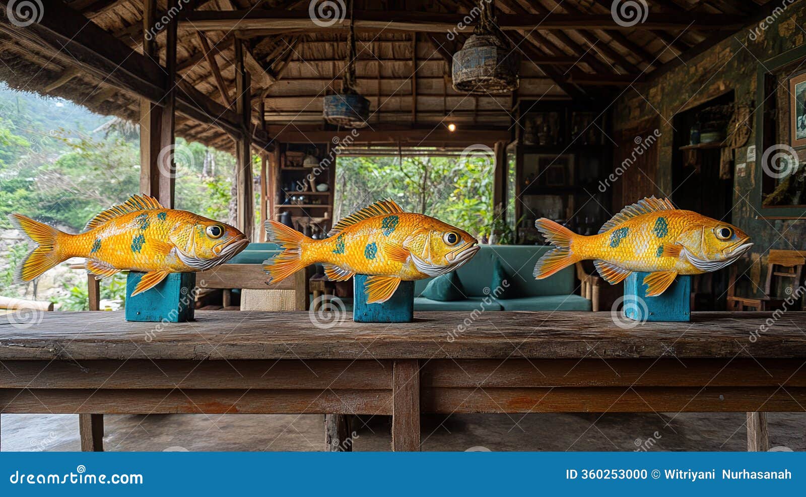 Tropical Fish Sculptures Displayed in Rustic Restaurant Stock Photo ...