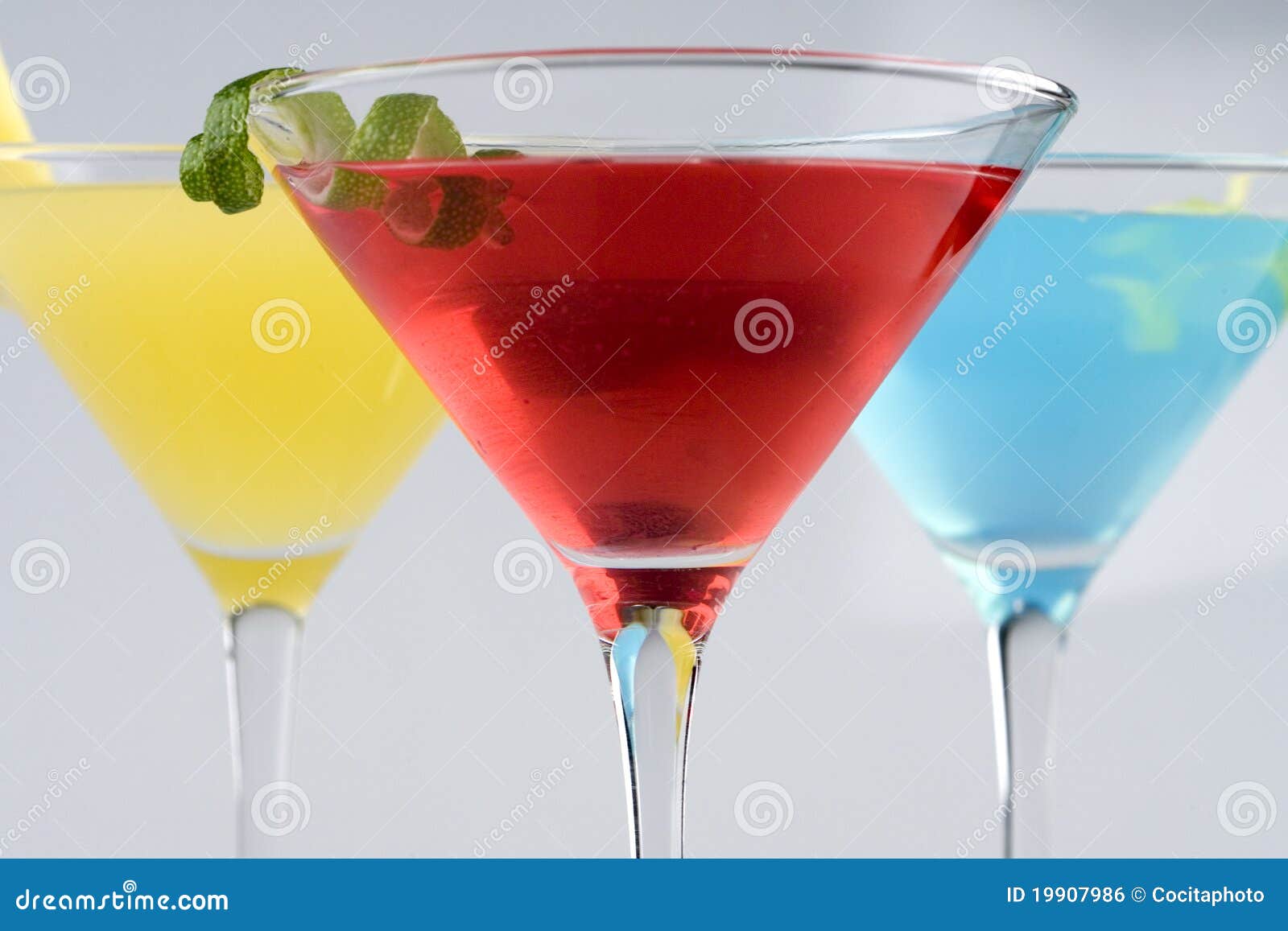 Tropical Martini Style Drinks with Fruit & Garnish Stock Photo - Image ...