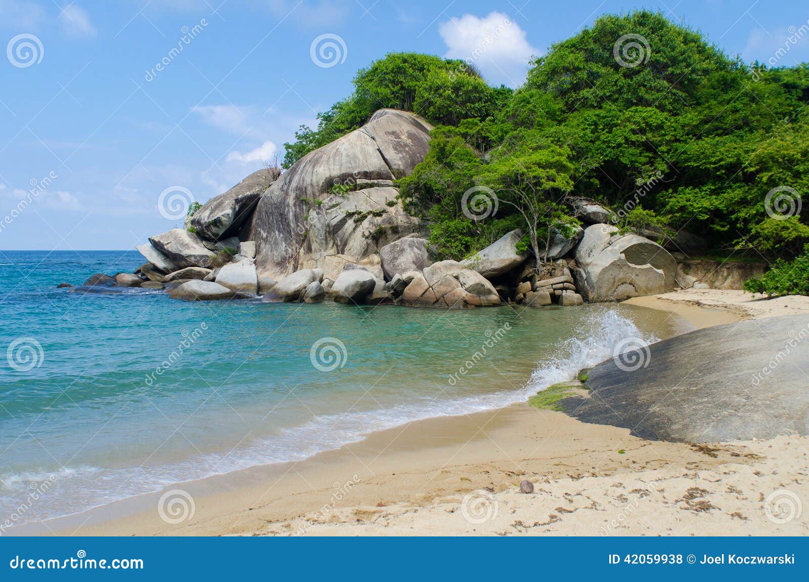 Tropical Sandy Beach with Rock Formations and Forest Stock Photo ...