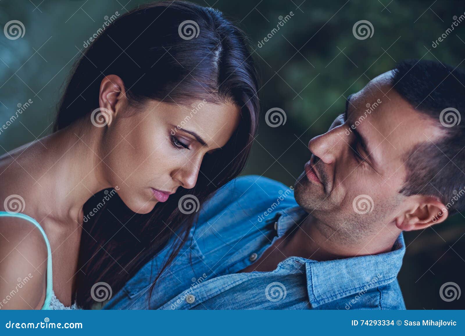 Troubled Couple Hugging and Looking Down Stock Photo - Image of ...