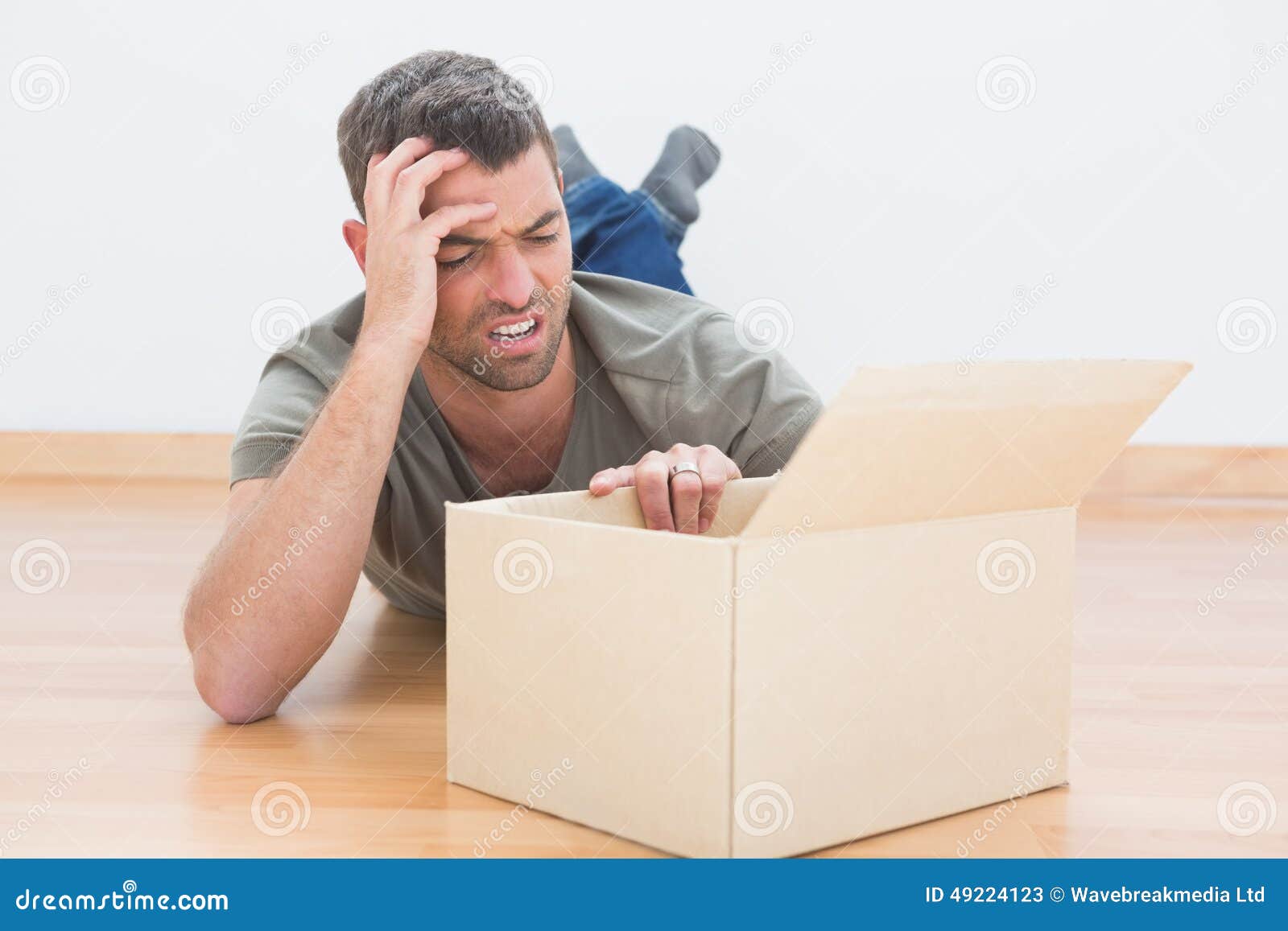 Troubled Man Open a Moving Box at Home Stock Image - Image of domestic ...