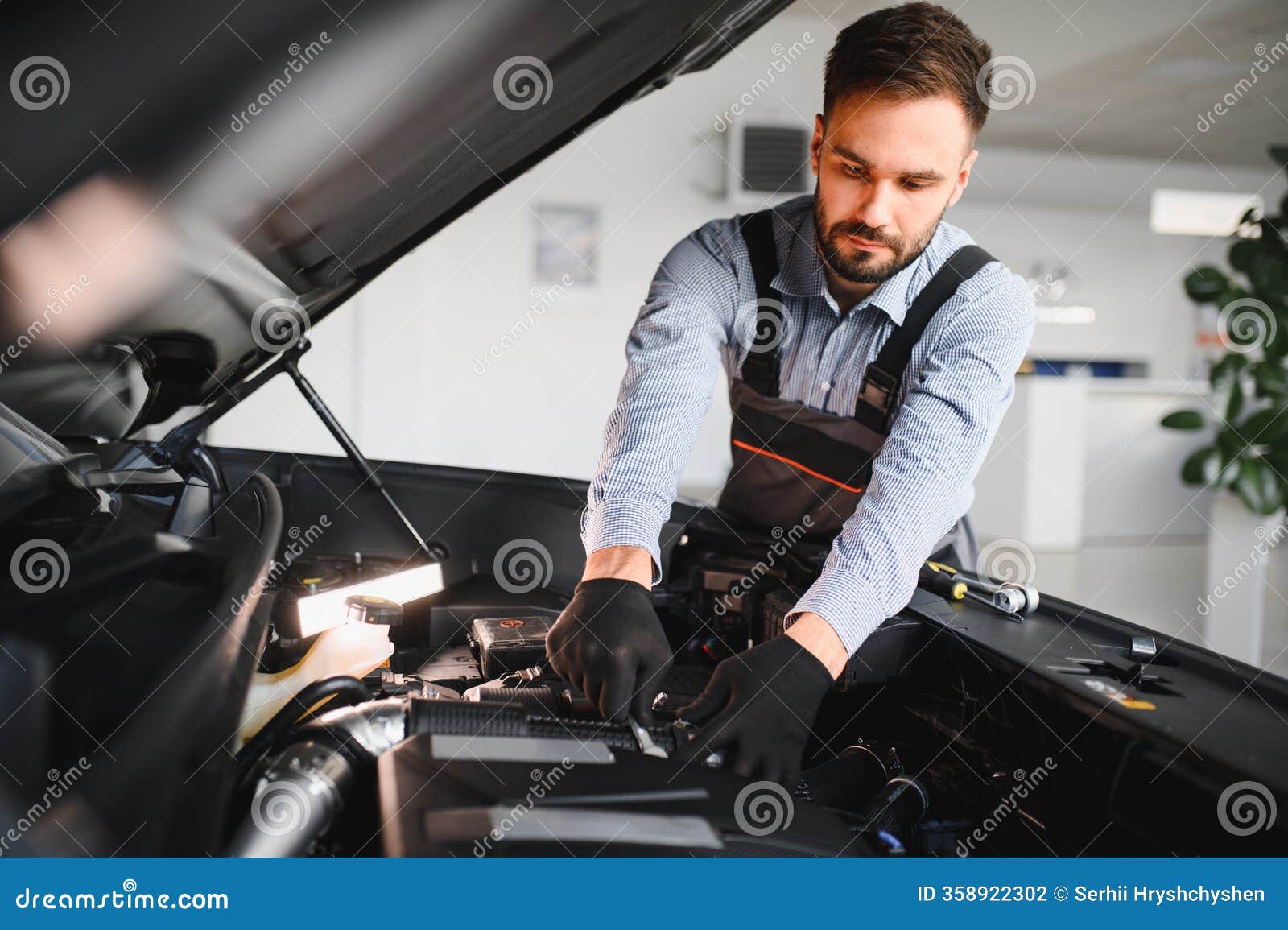 Troubleshooting Process. Auto Mechanic Working in Garage Stock Photo ...