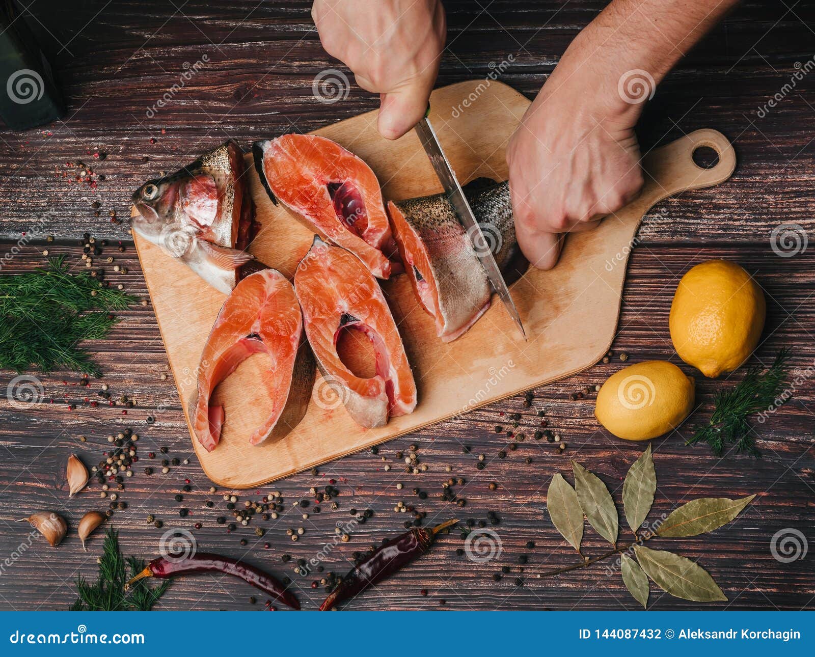 Trout on the Board, Which Cuts a Man Cook with a Knife. Fresh Raw Red ...