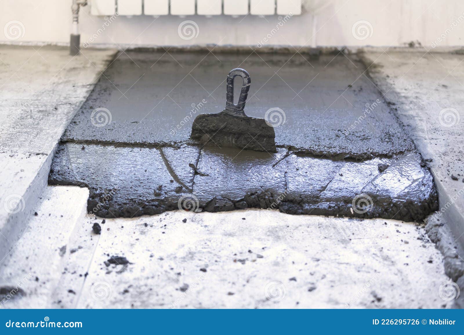 A Trowel in a Layer of Fresh Concrete Stock Photo - Image of layer ...
