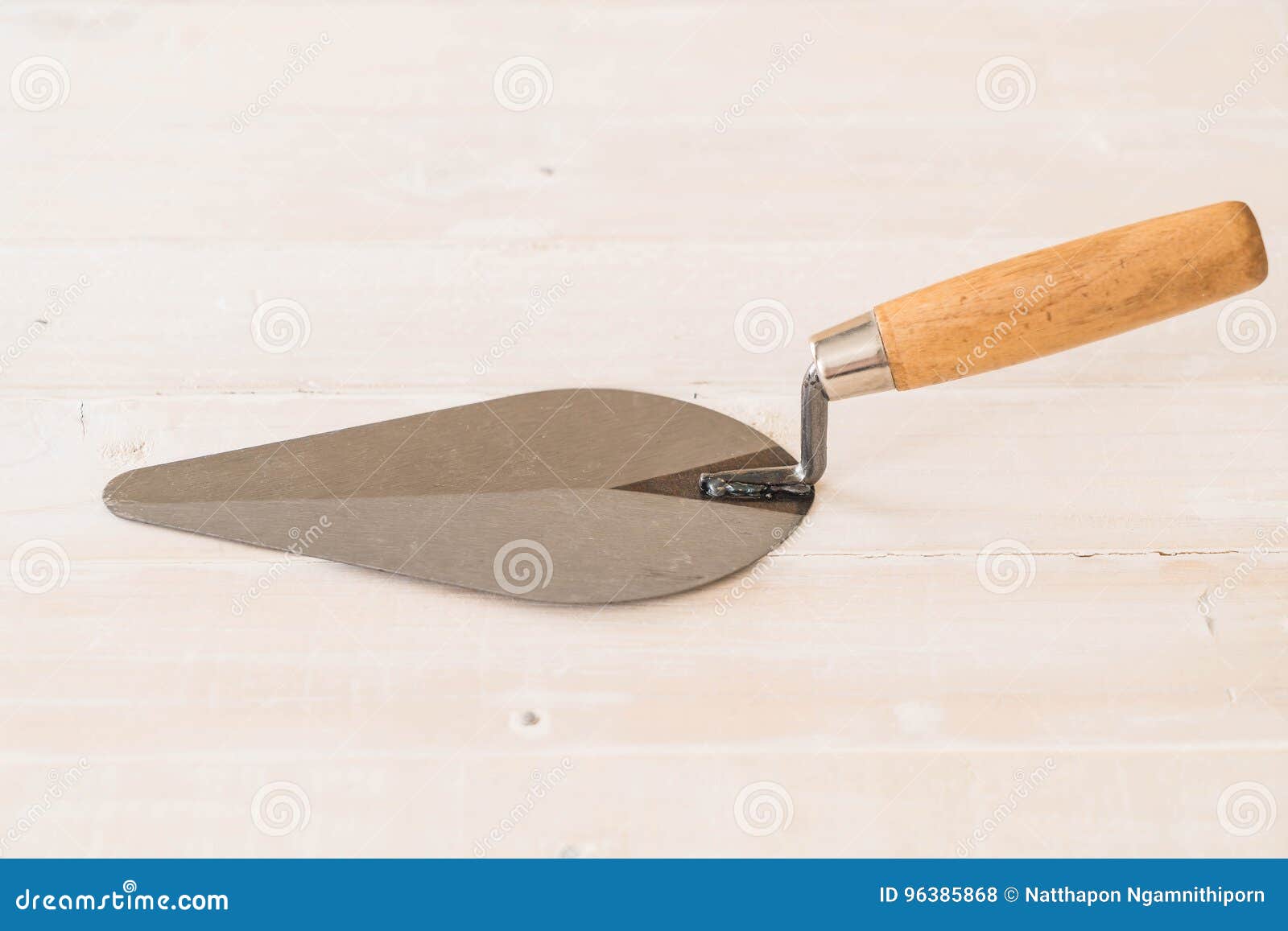Trowel the mortar on wood stock photo. Image of site - 96385868