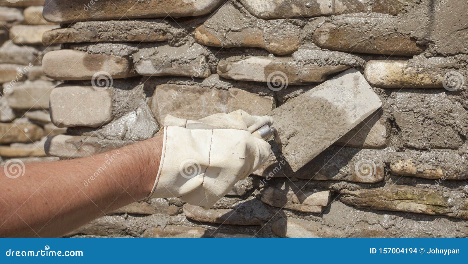 Trowel tool for stone wall stock photo. Image of background - 157004194