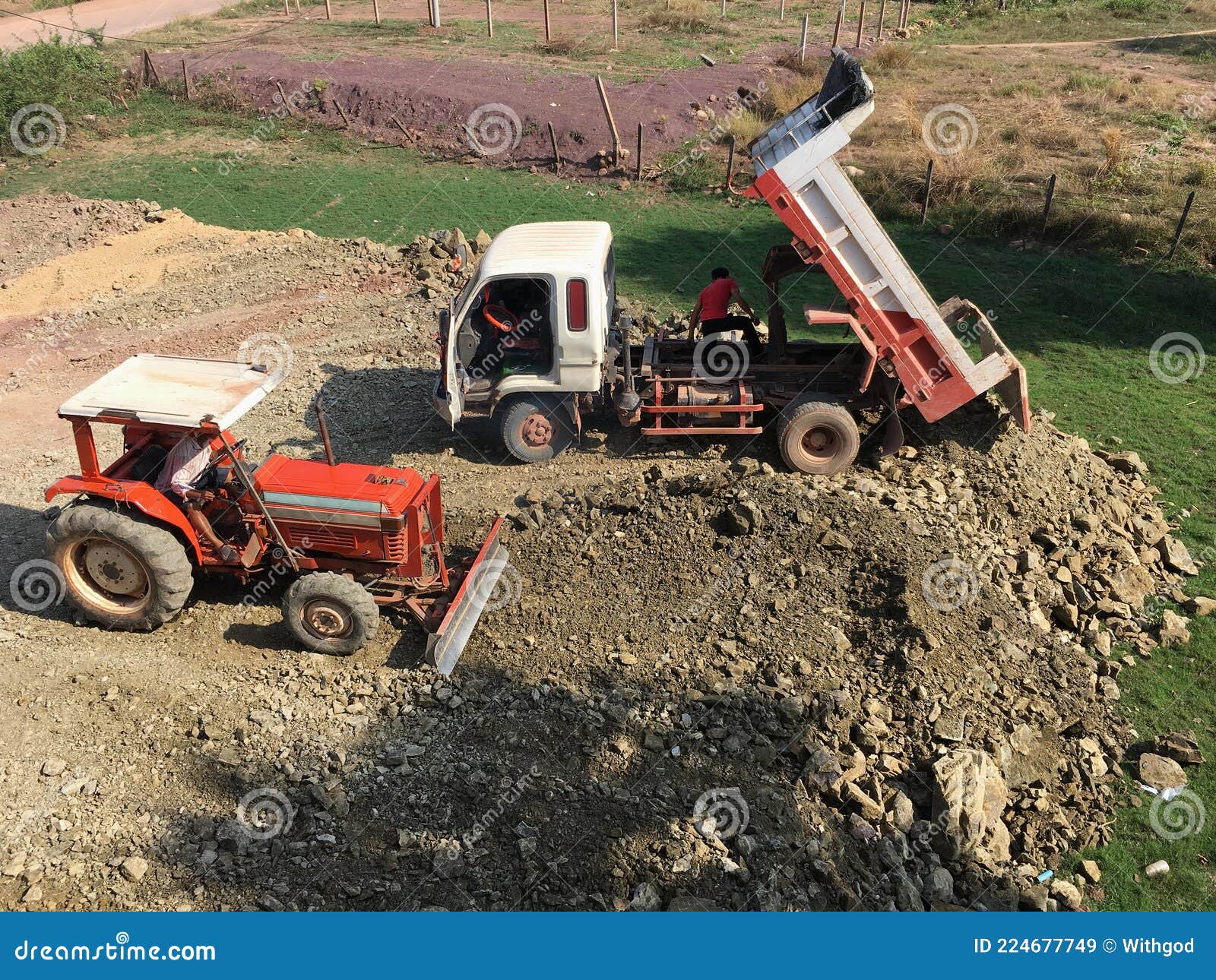 Truck and Bulldozer Dirt Leveling on Plot of Land Stock Image - Image ...