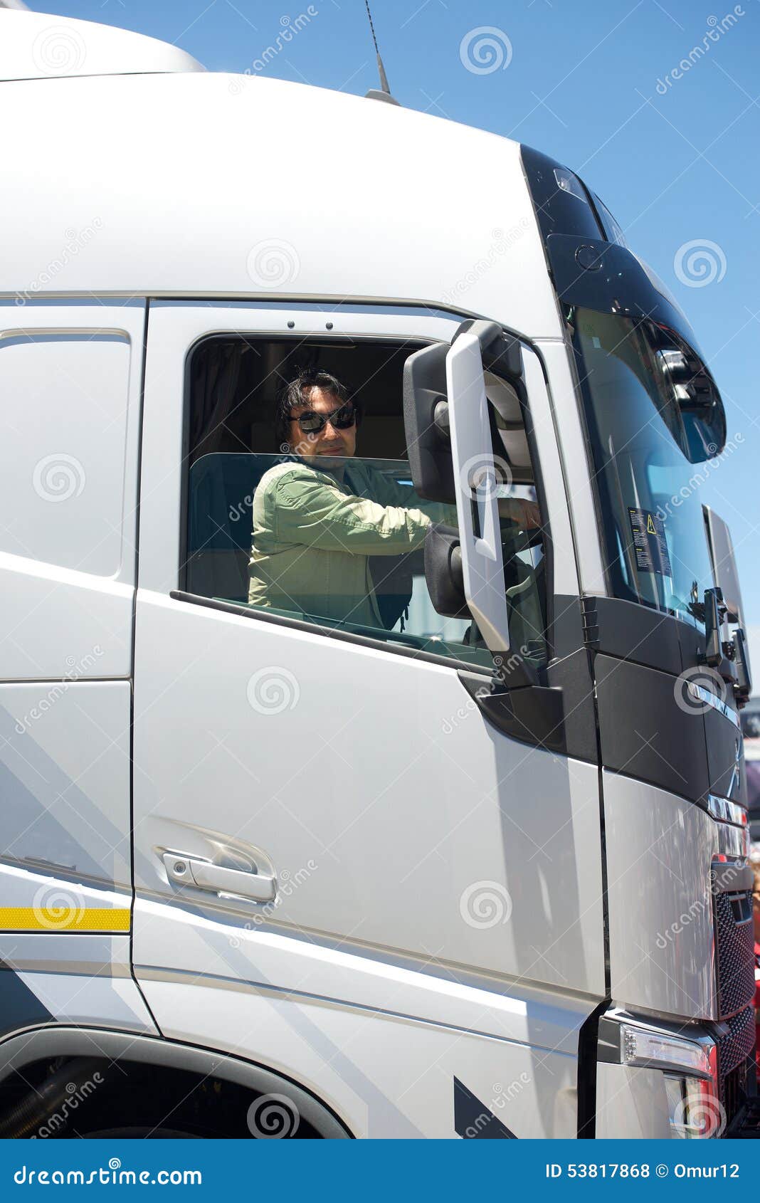 Truck driver in cabin stock photo. Image of inspection - 53817868