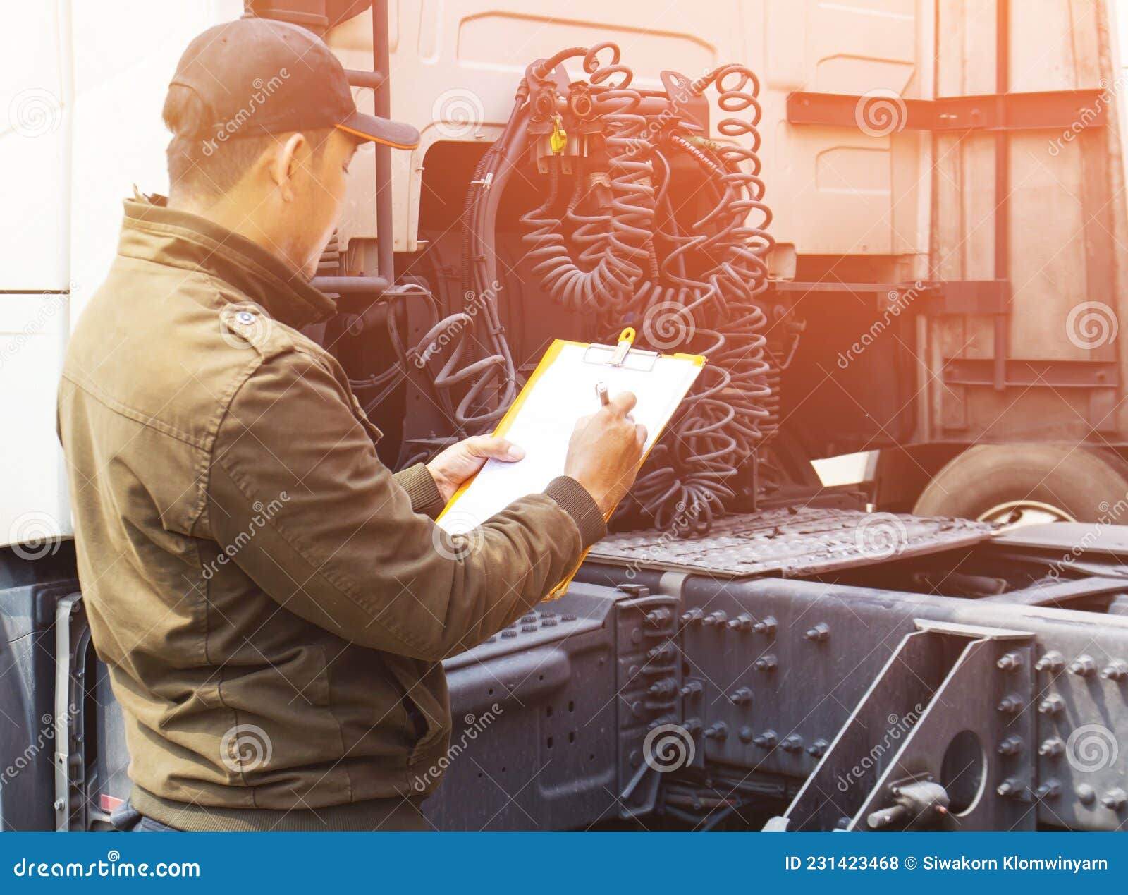 Truck Driver is Checking the Truck`s Safety Maintenance Checklist ...