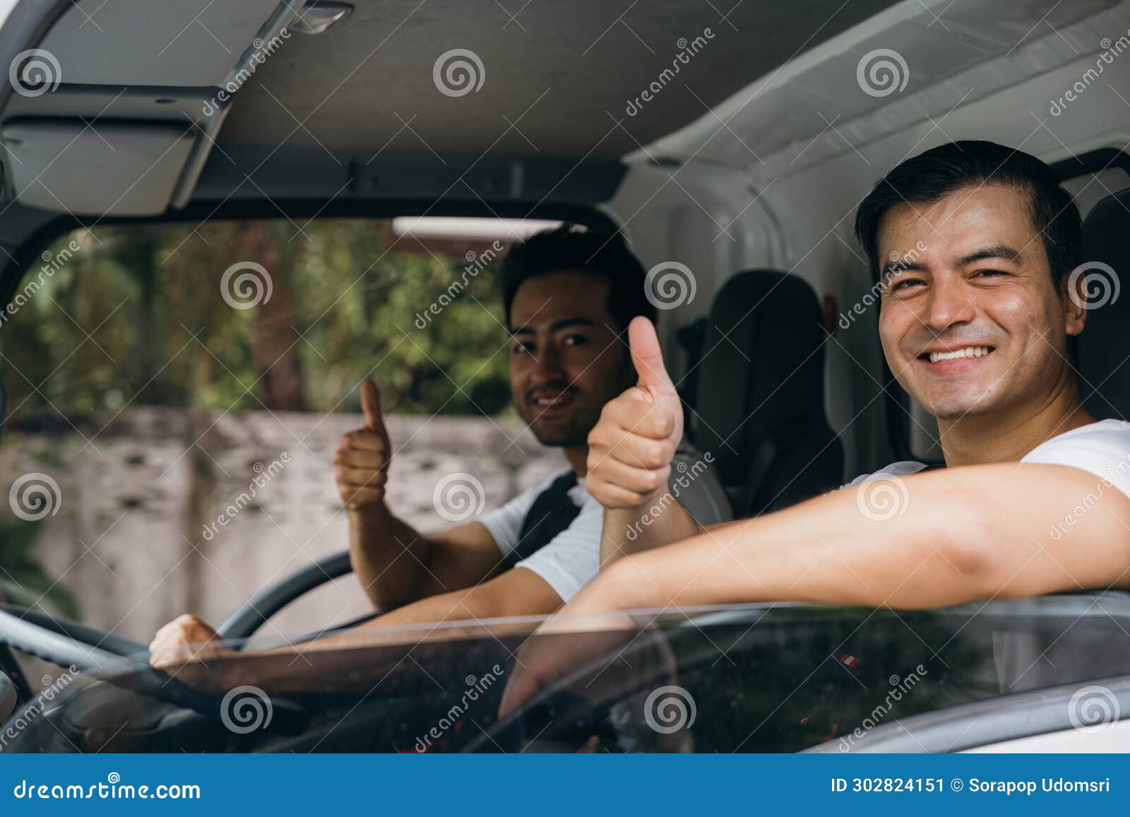 Ethnically Diverse Mover Team Driving a Truck for Relocation Service ...