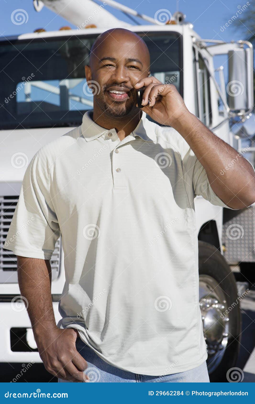 Truck Driver on Phone in Front of a Truck Stock Photo - Image of ...