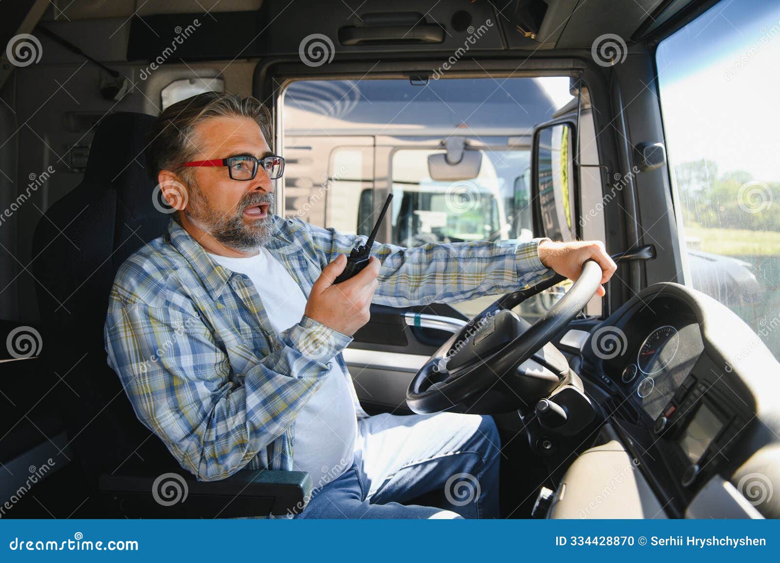 Truck Driver Talking on Walkie-talkie Stock Photo - Image of transport ...