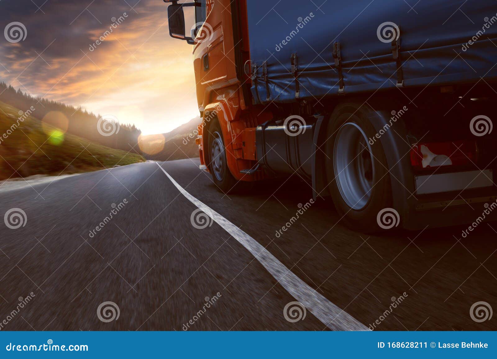 Truck drives into sunset stock image. Image of school - 168628211