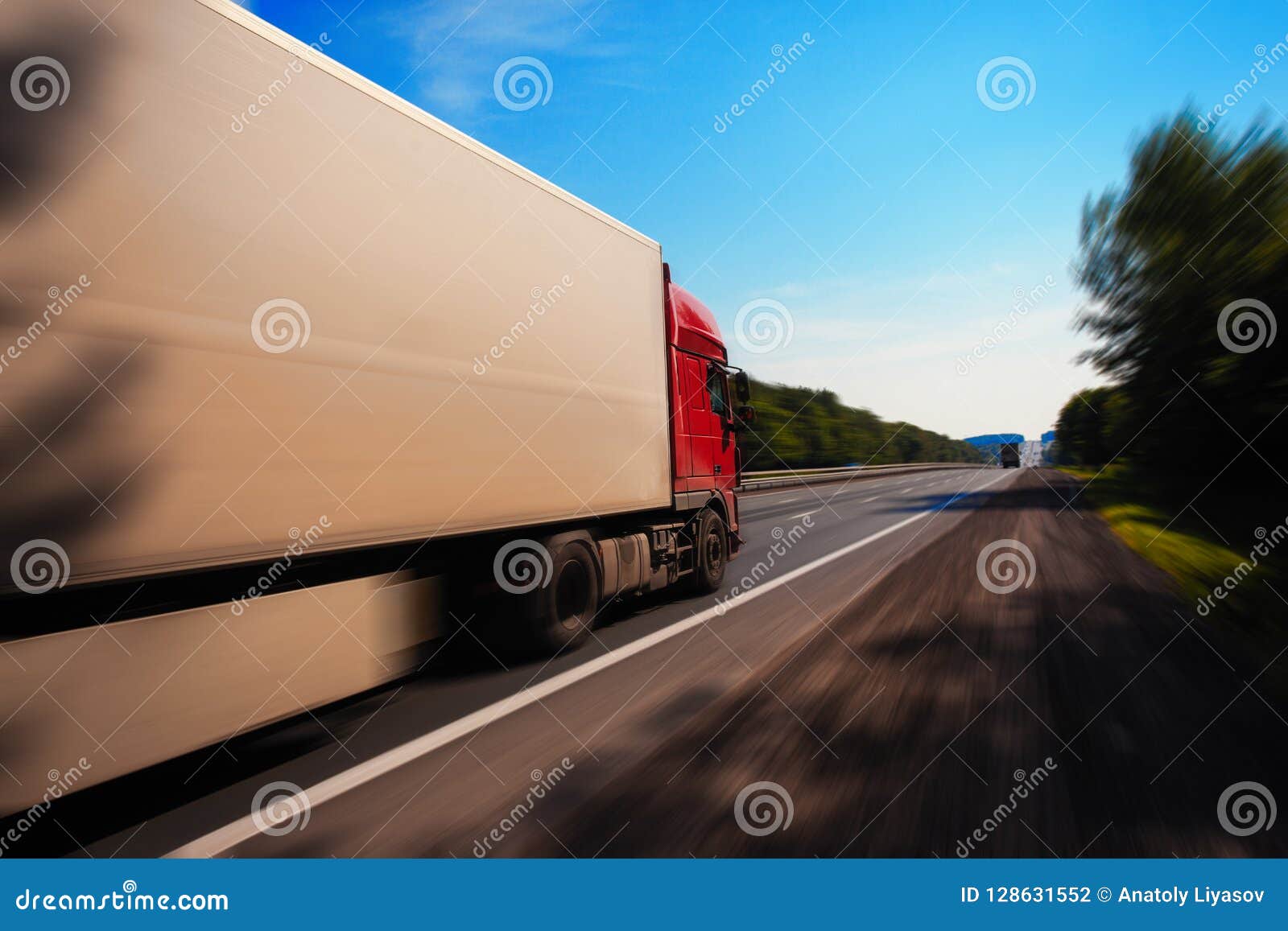 A Truck is Driving Down the Road Stock Photo - Image of scenic ...