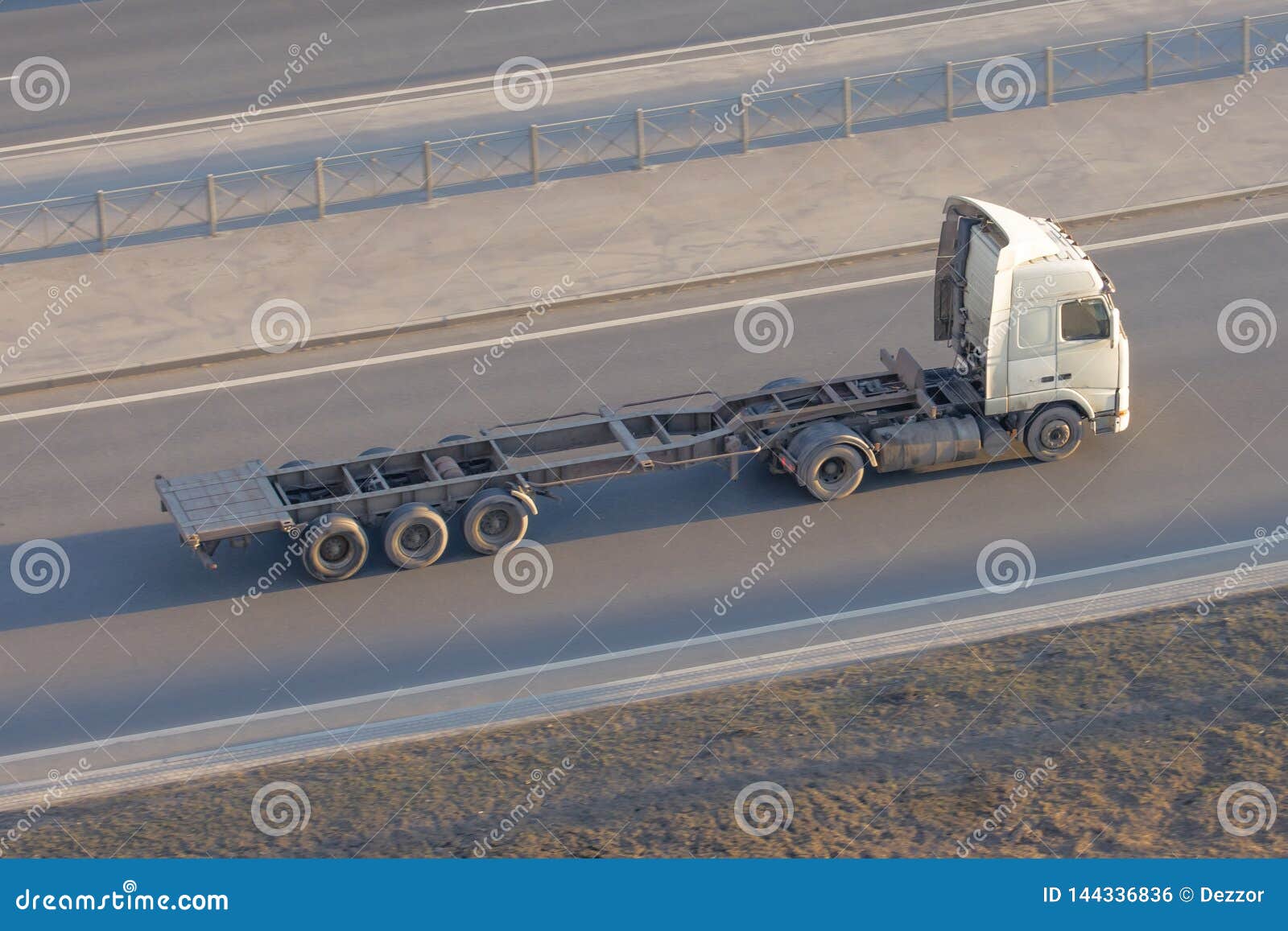 Truck with an Empty Long Trailer without Cargo, Driving on the Highway ...